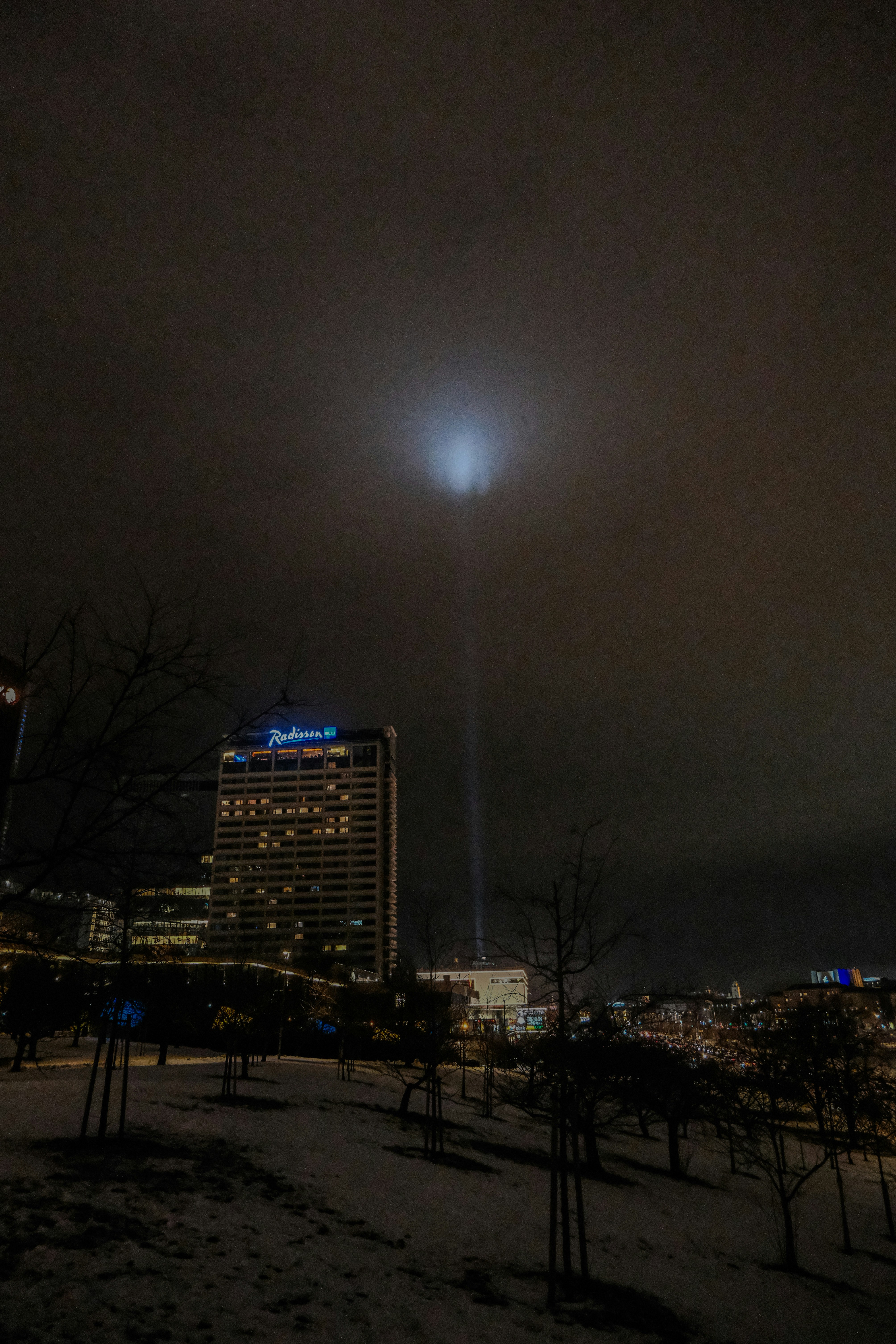 Beacon into the Night: Spotlight Reaches the Sky over the City