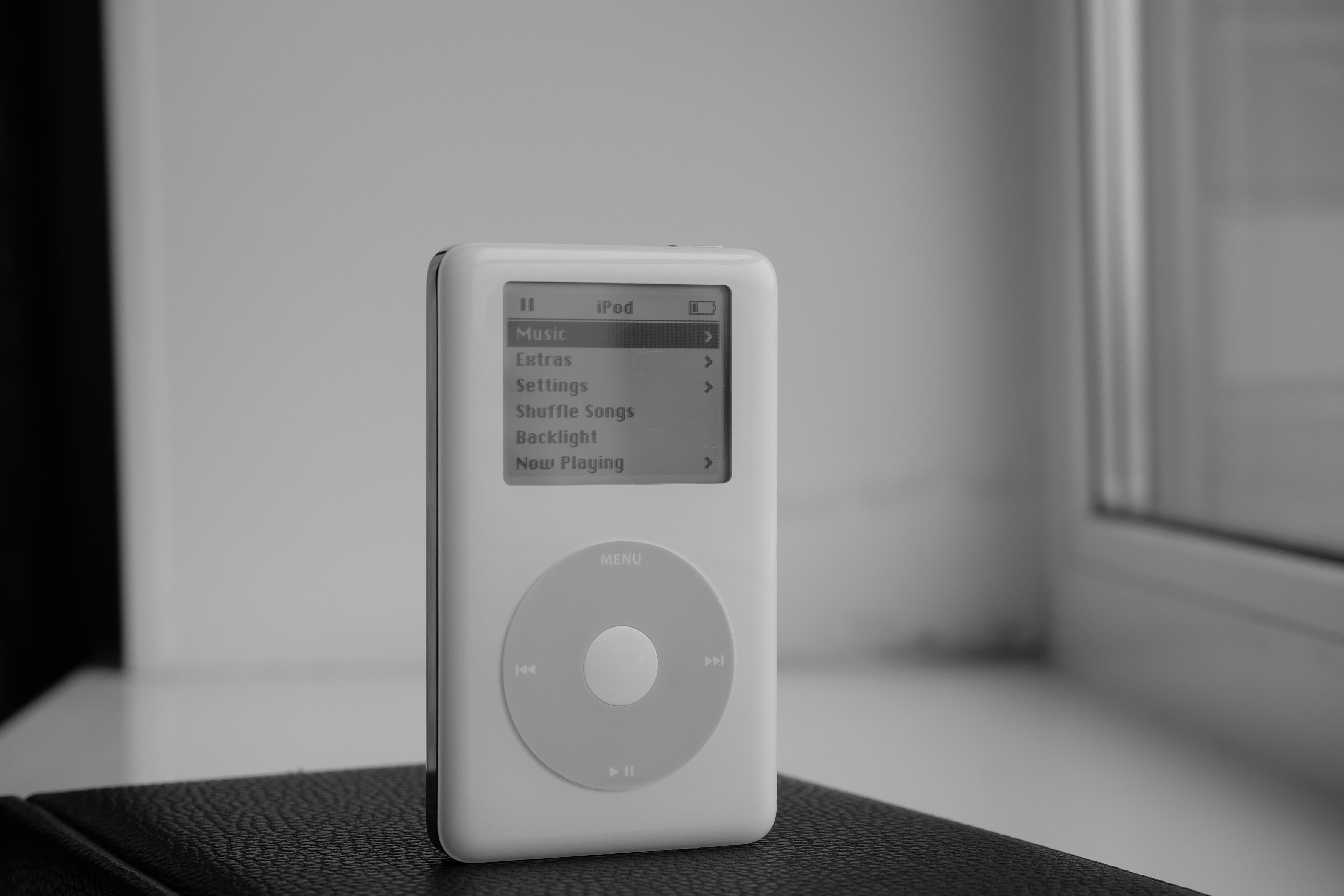 a black and white photo of an ipod