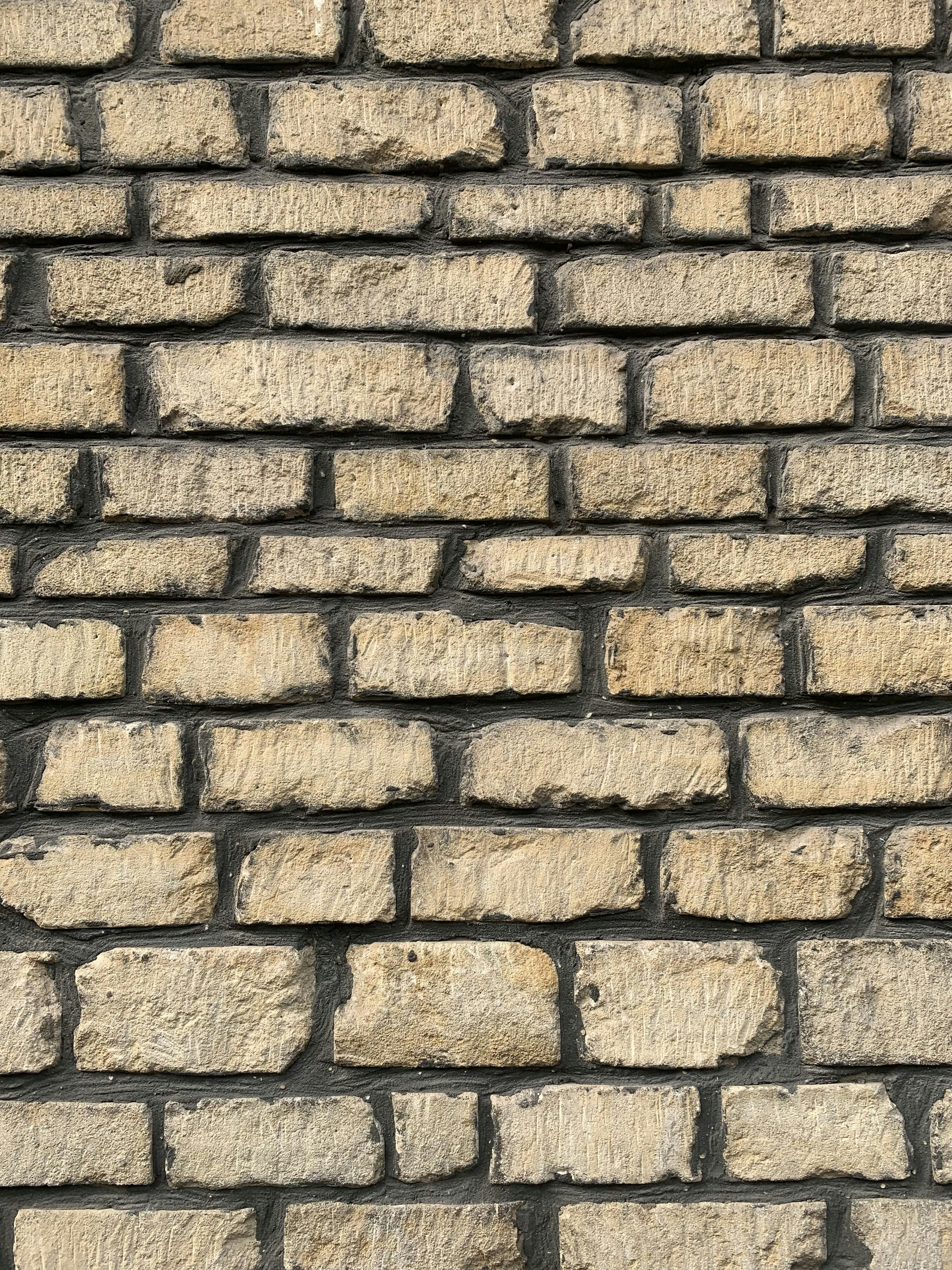 A close up of a brick wall made of bricks photo – Free Background Image ...