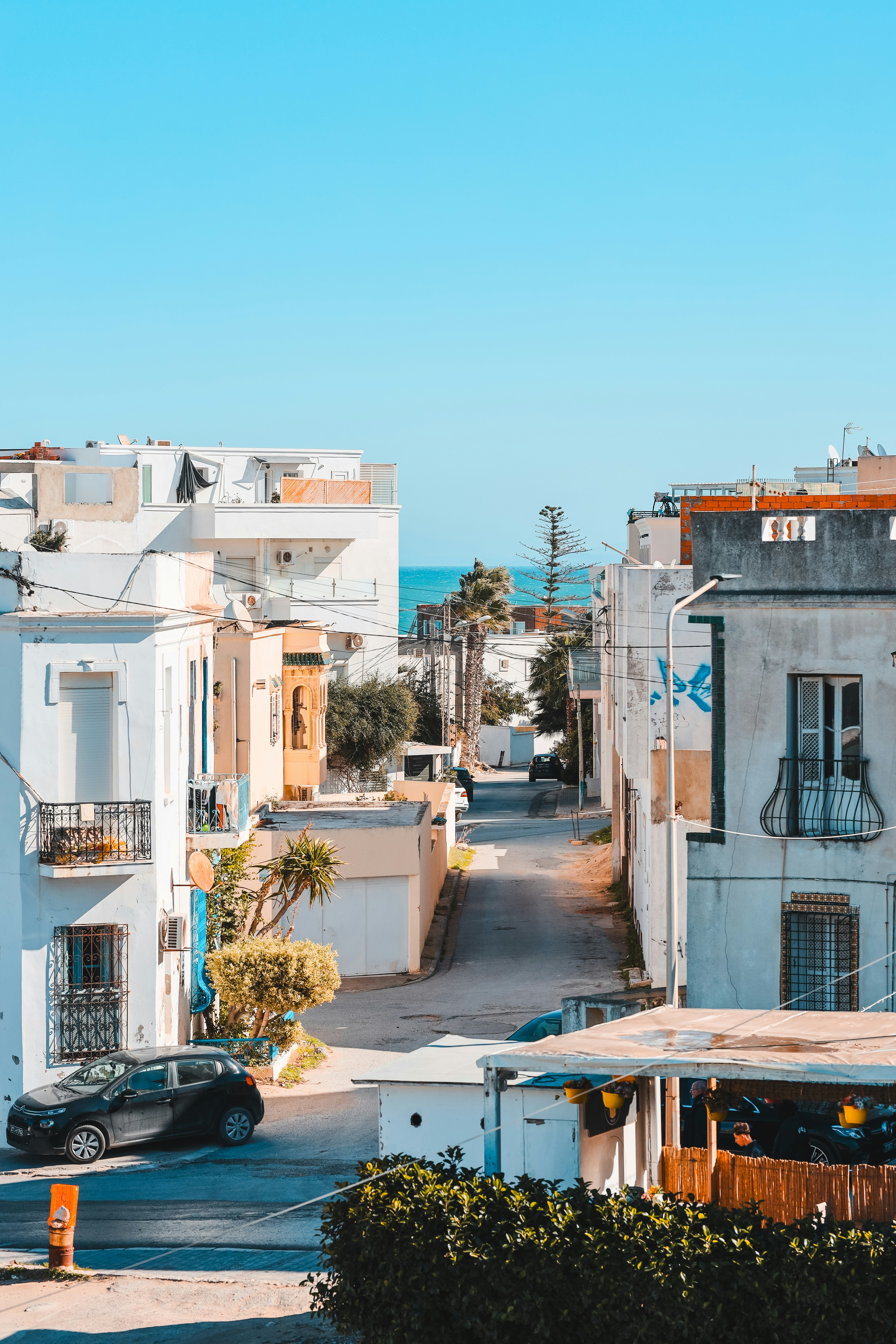 Leading Lines to the Sea: Sunlit Mediterranean Street