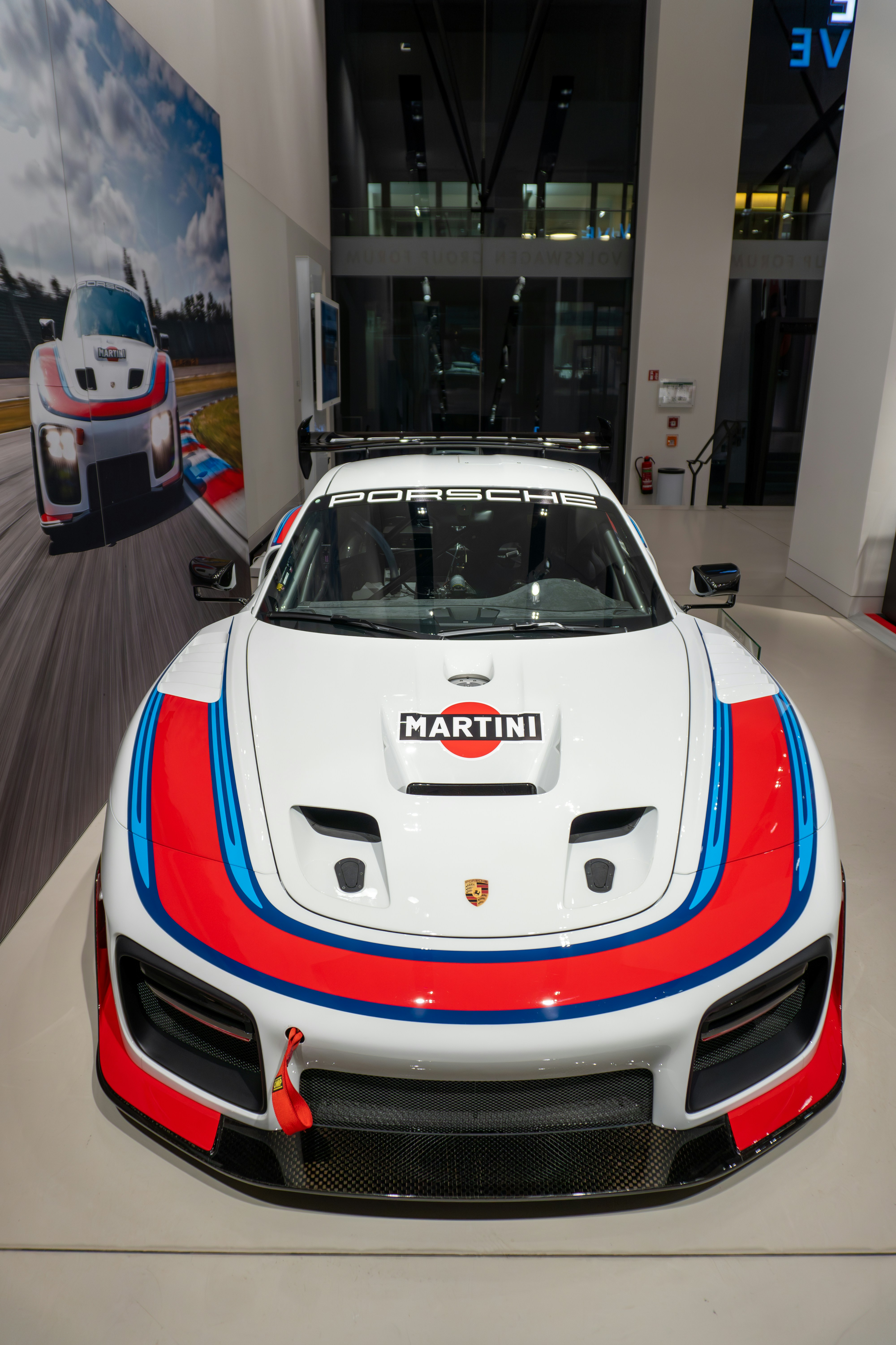 Porsche Martini Livery: A Classic Racecar Portrait at the Showroom