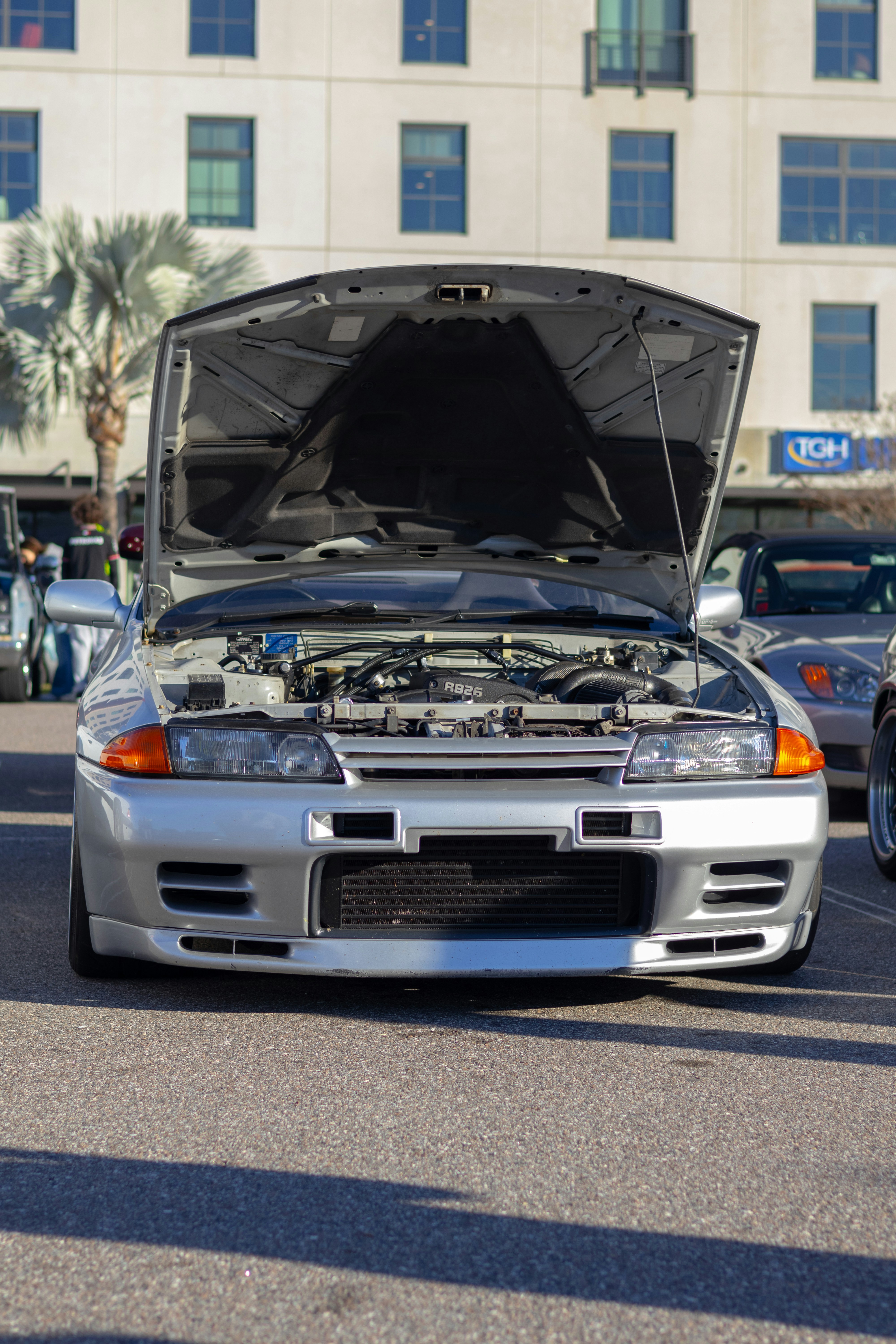 A silver sports car with its hood open photo – Free Nissan skyline r32 ...