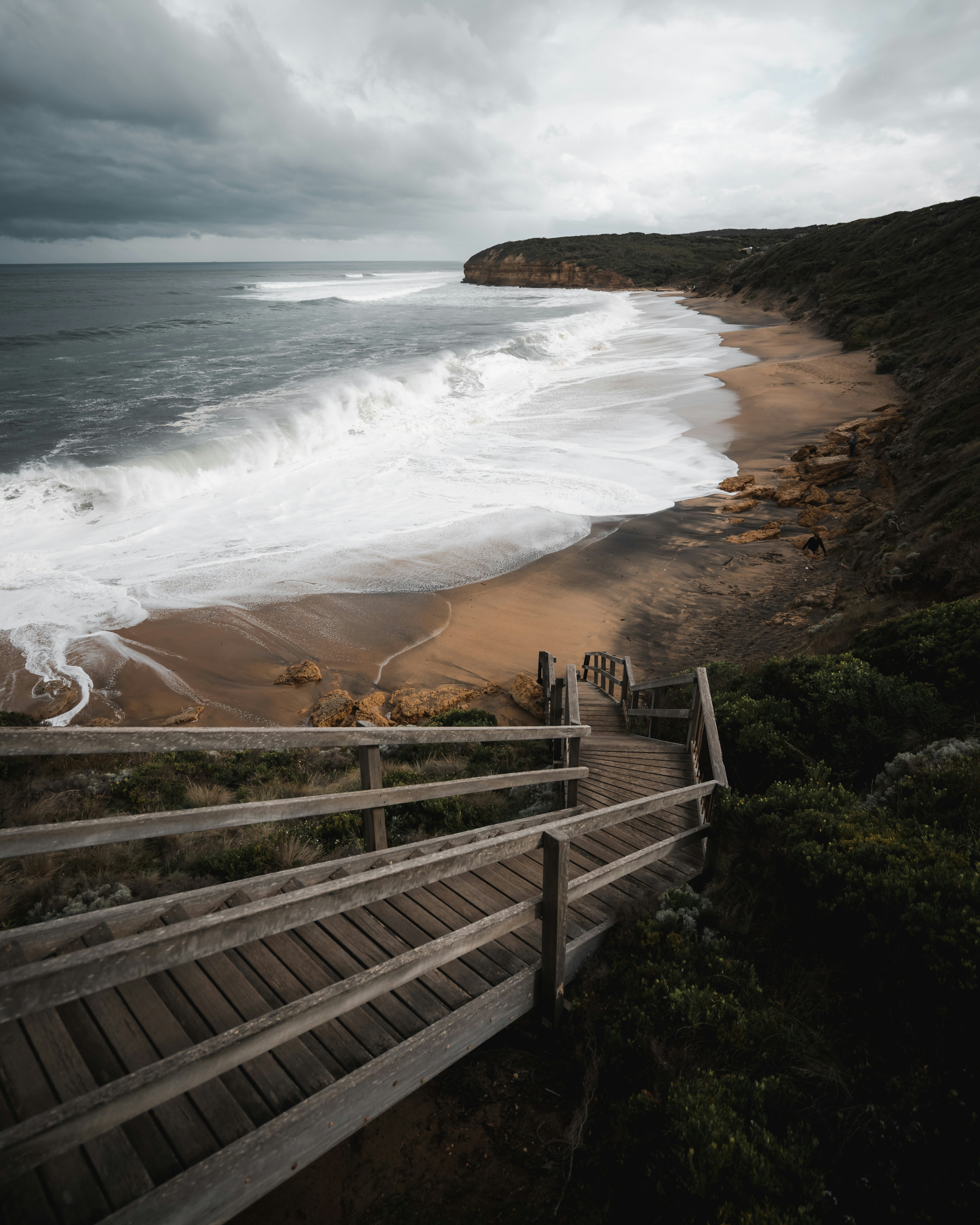 Weathered Boardwalk Leading to a Storm-Whipped Beach