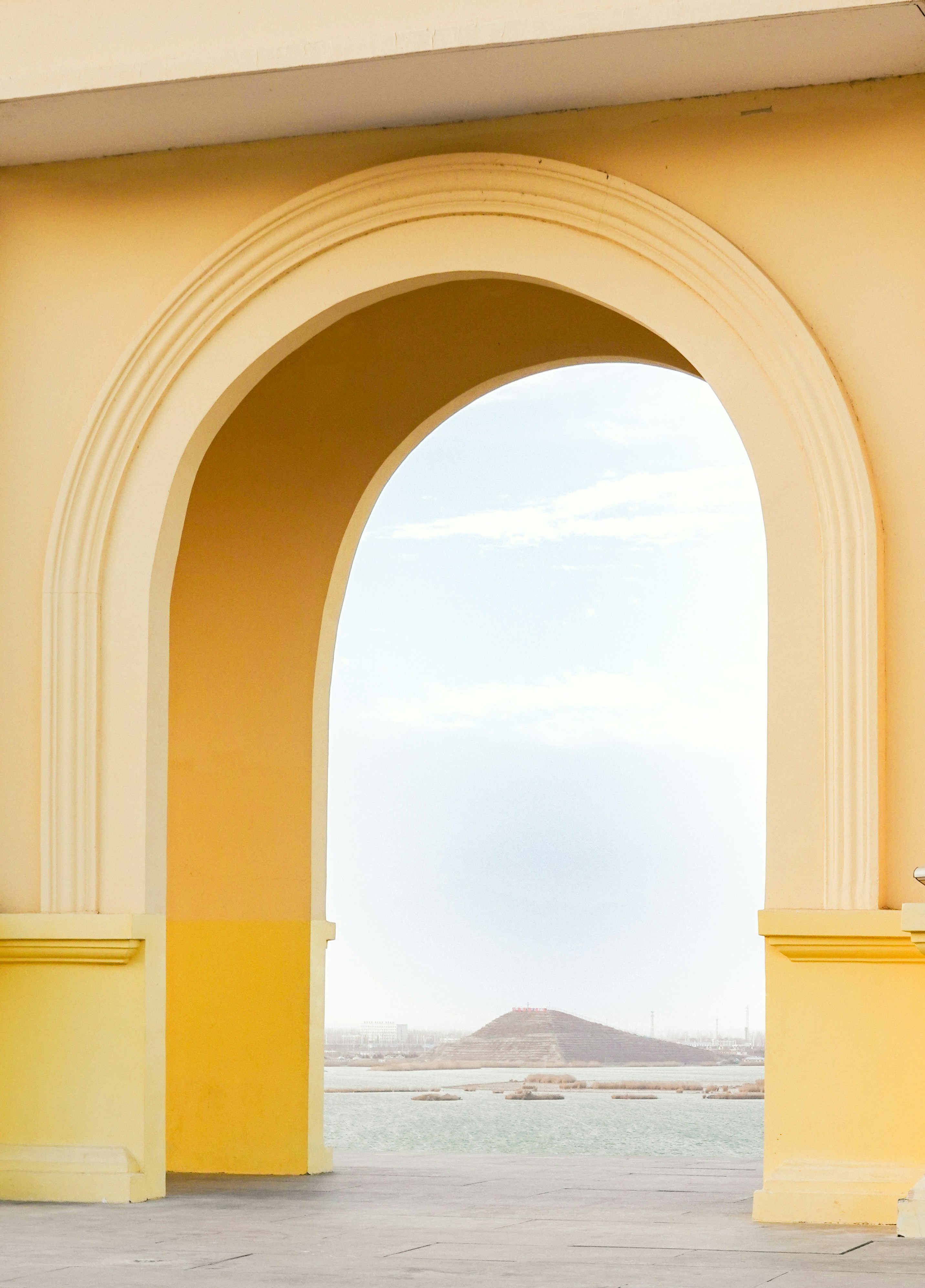 Golden Archway Framing a Distant Harbor