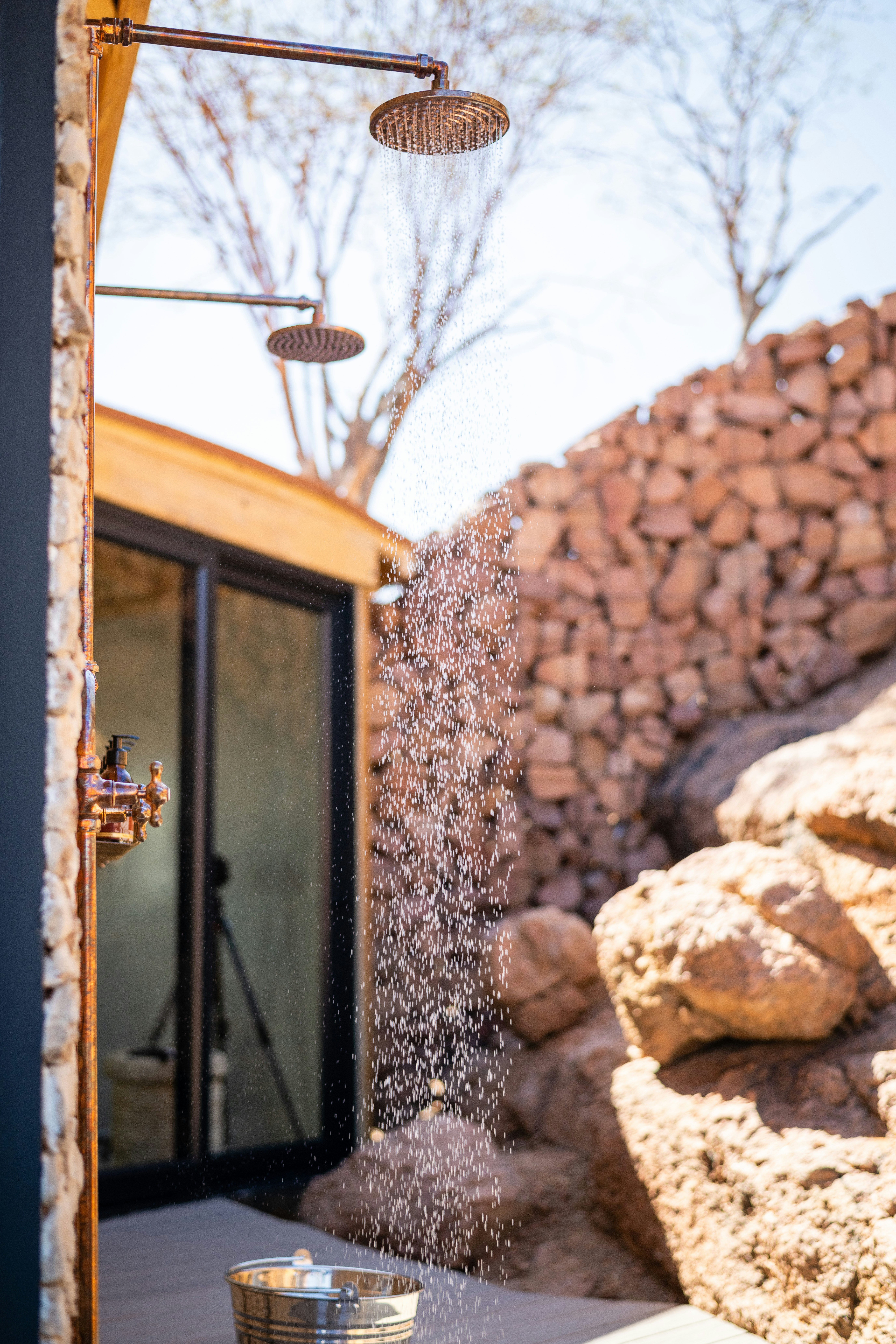 Outdoor Shower in a Rustic Rock Courtyard