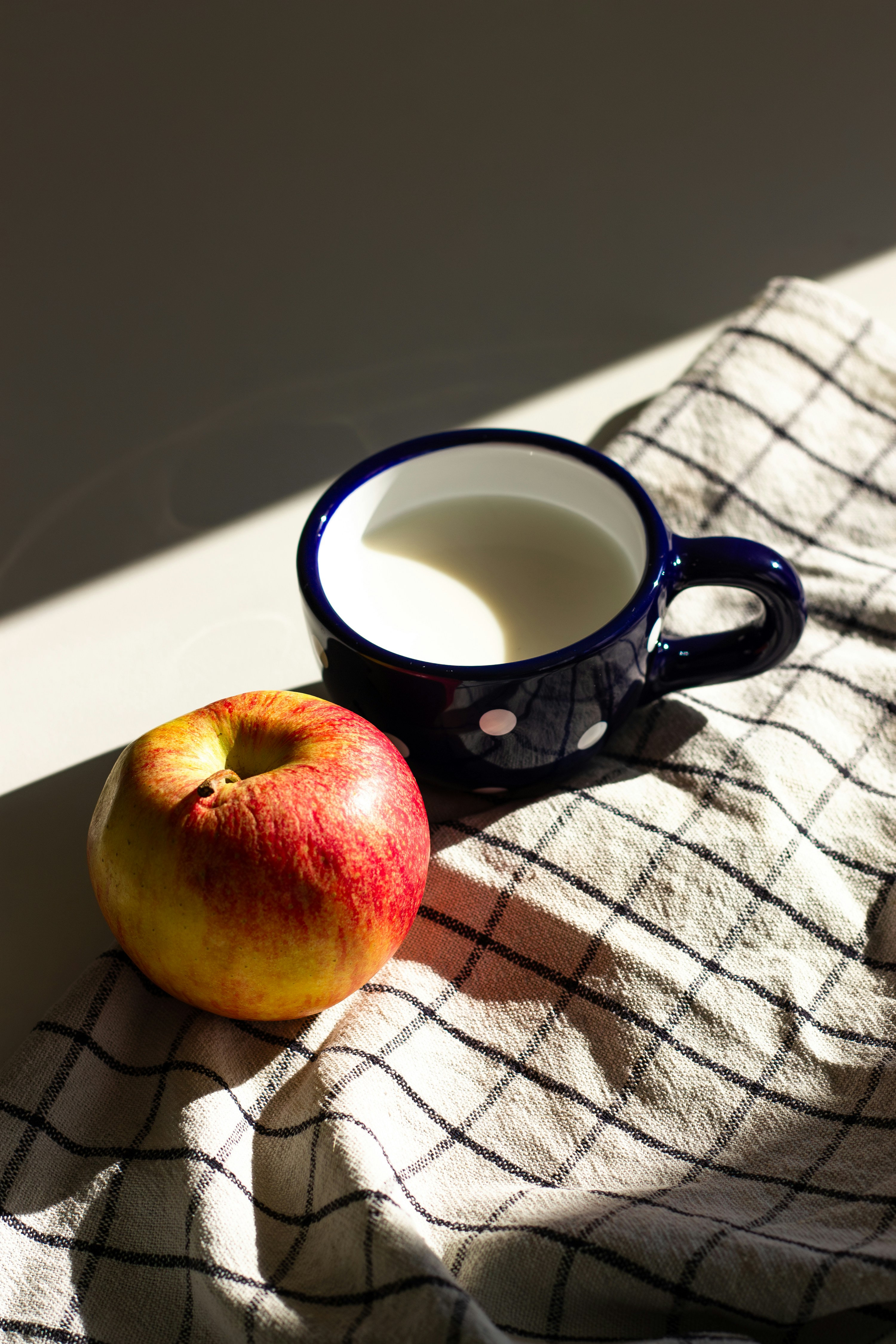 Morning Quiet: Apple and Mug on a Sunlit Linen