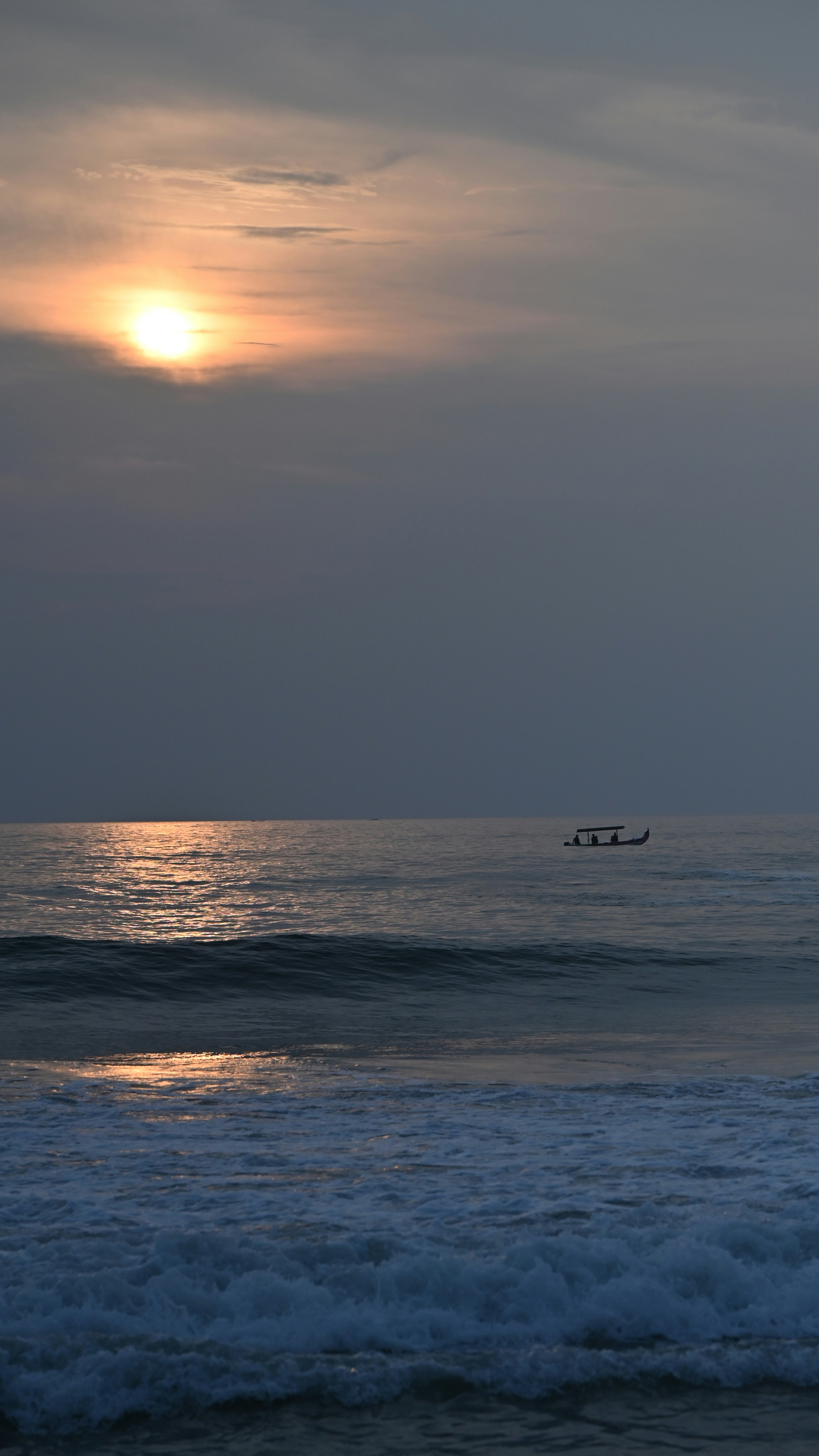 a person riding a surfboard on a wave in the ocean