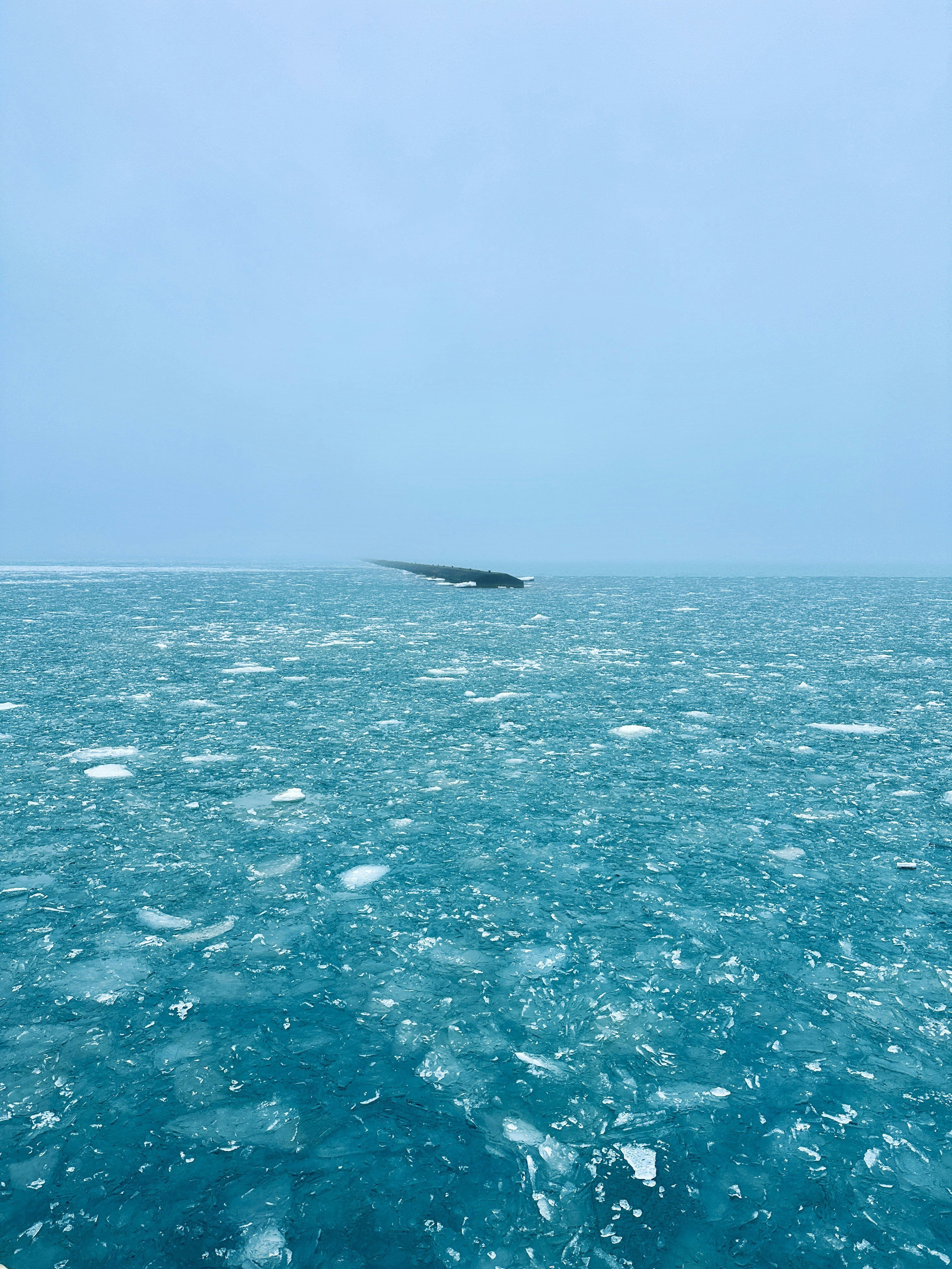 A boat floating on top of a large body of water photo – Free Chicago ...