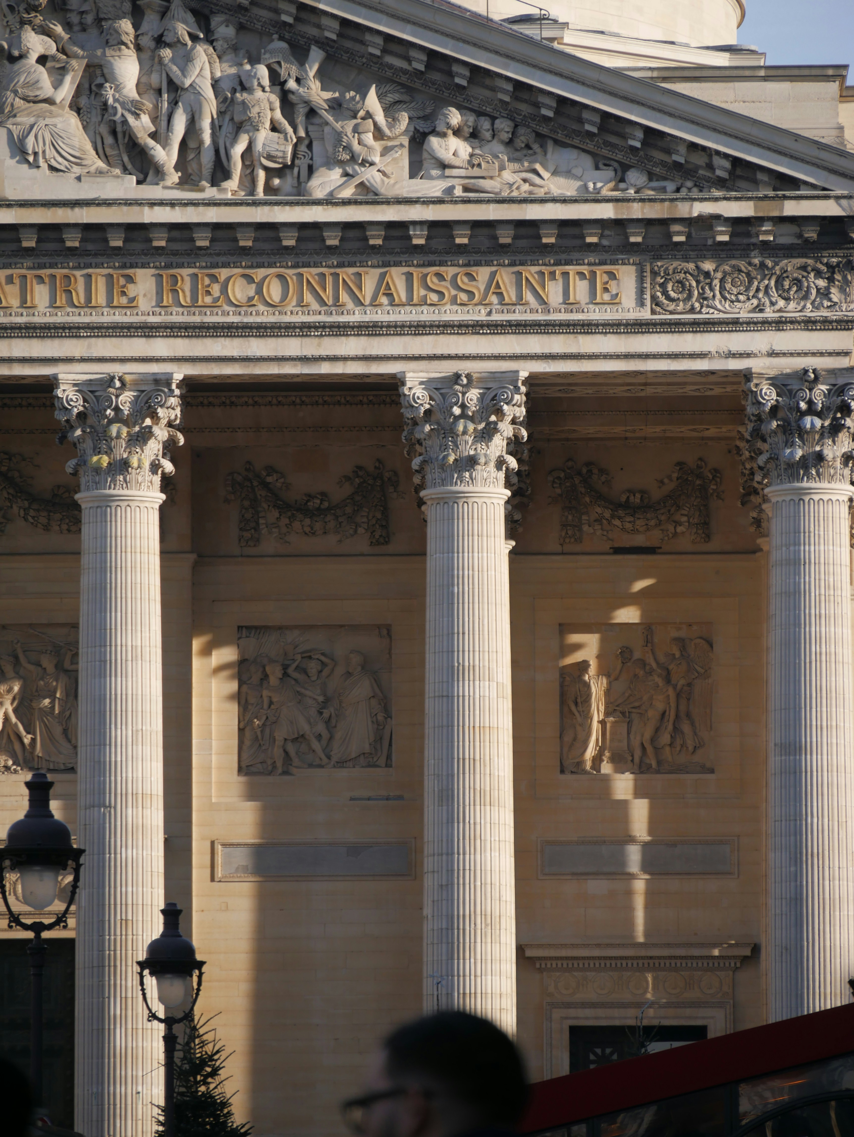 Beaux-Arts Sentinel: Light on Colonnade and Frieze of Patrie Reconnaissante