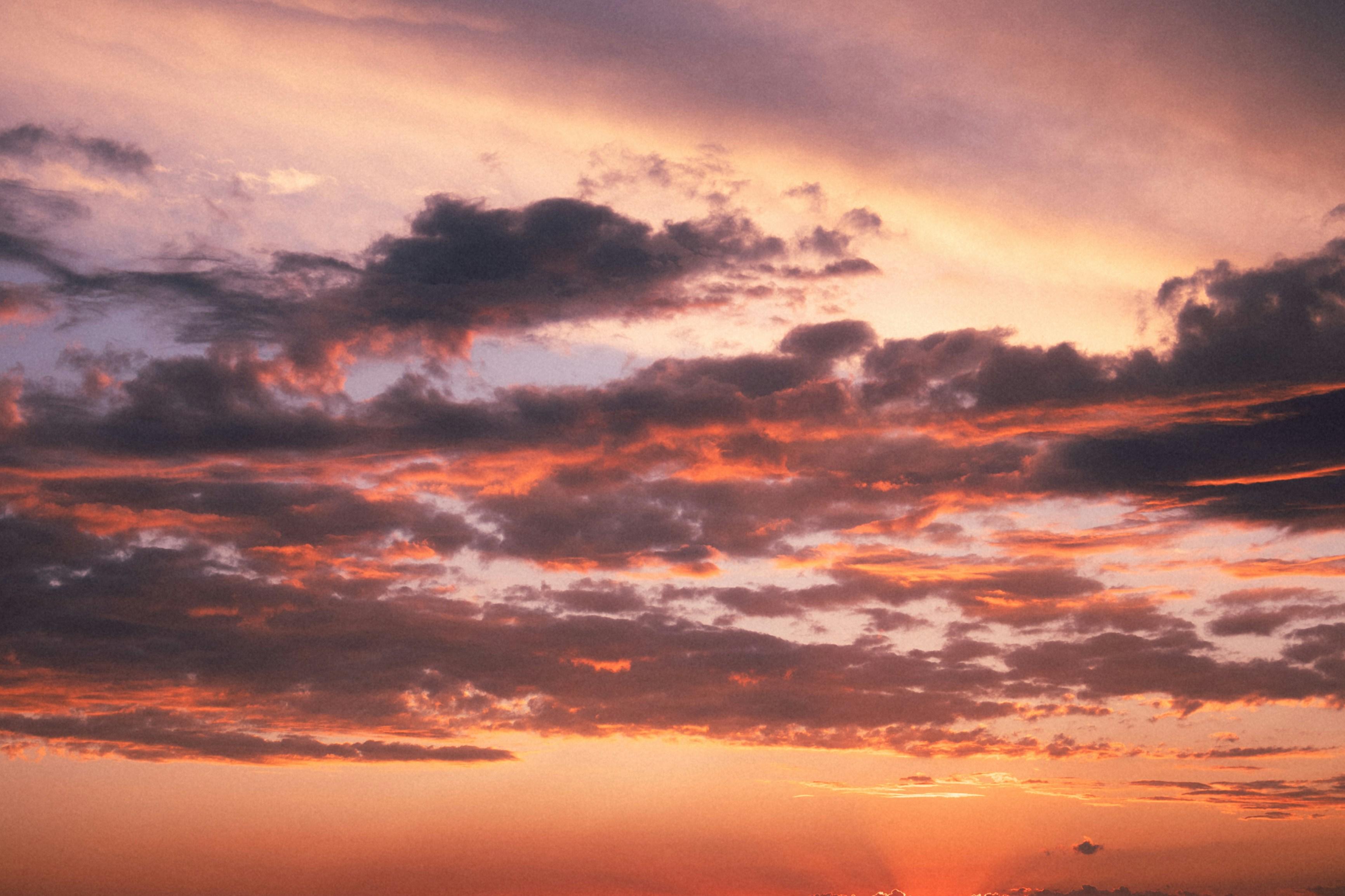 the sun is setting over a body of water