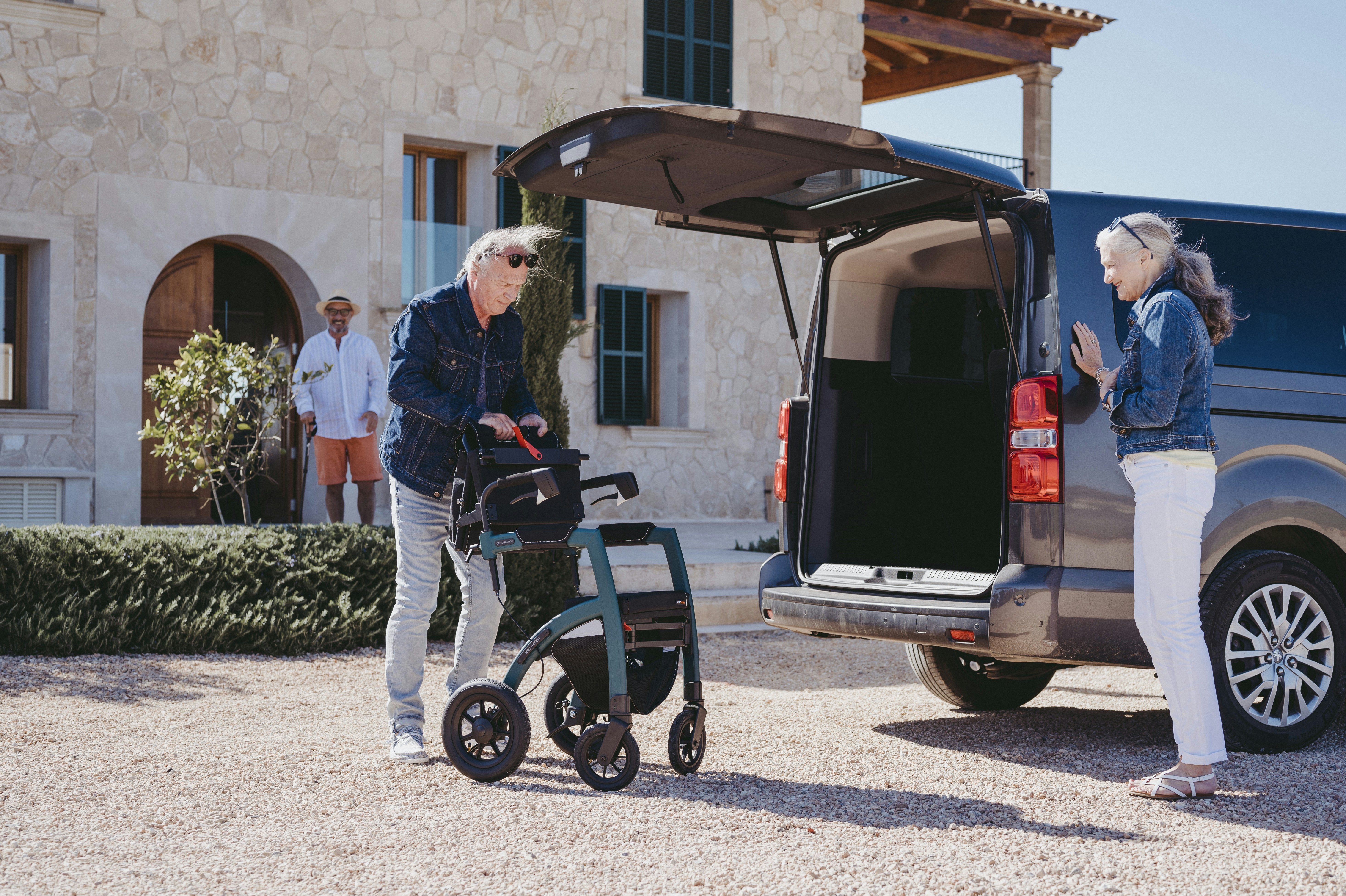 A woman pushing a stroller next to a van photo – Free Mobility Image on Unsplash