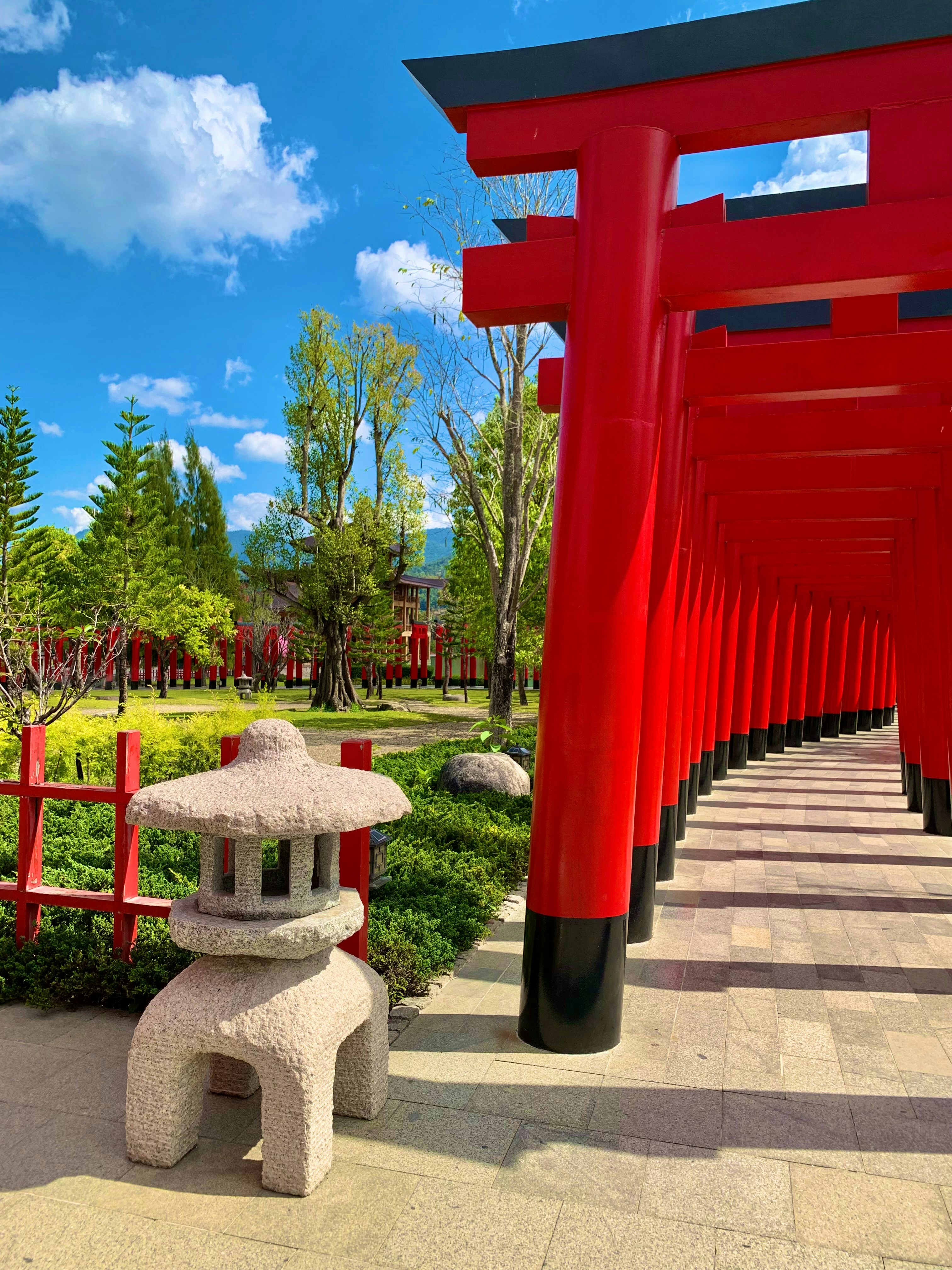 Vermilion Arcades: A Sunlit Torii Corridor