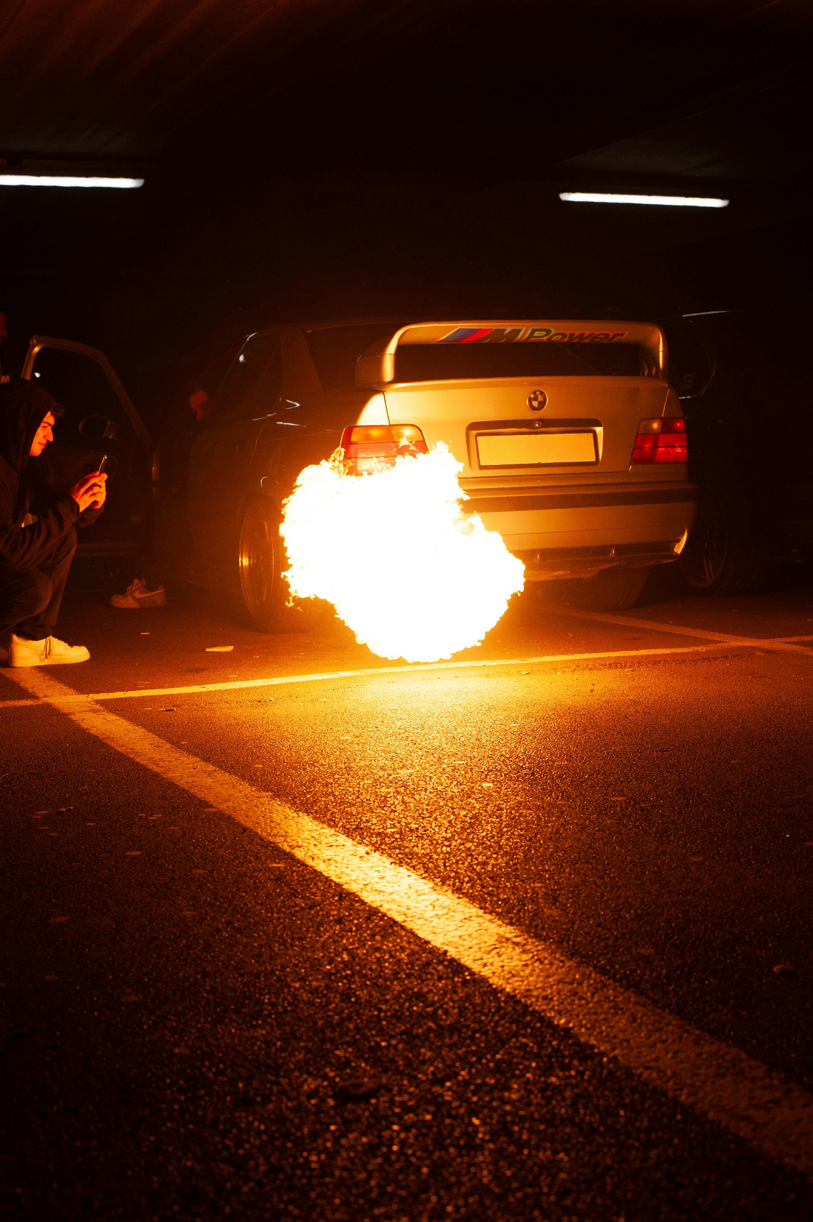 a car with a lot of flames on the road