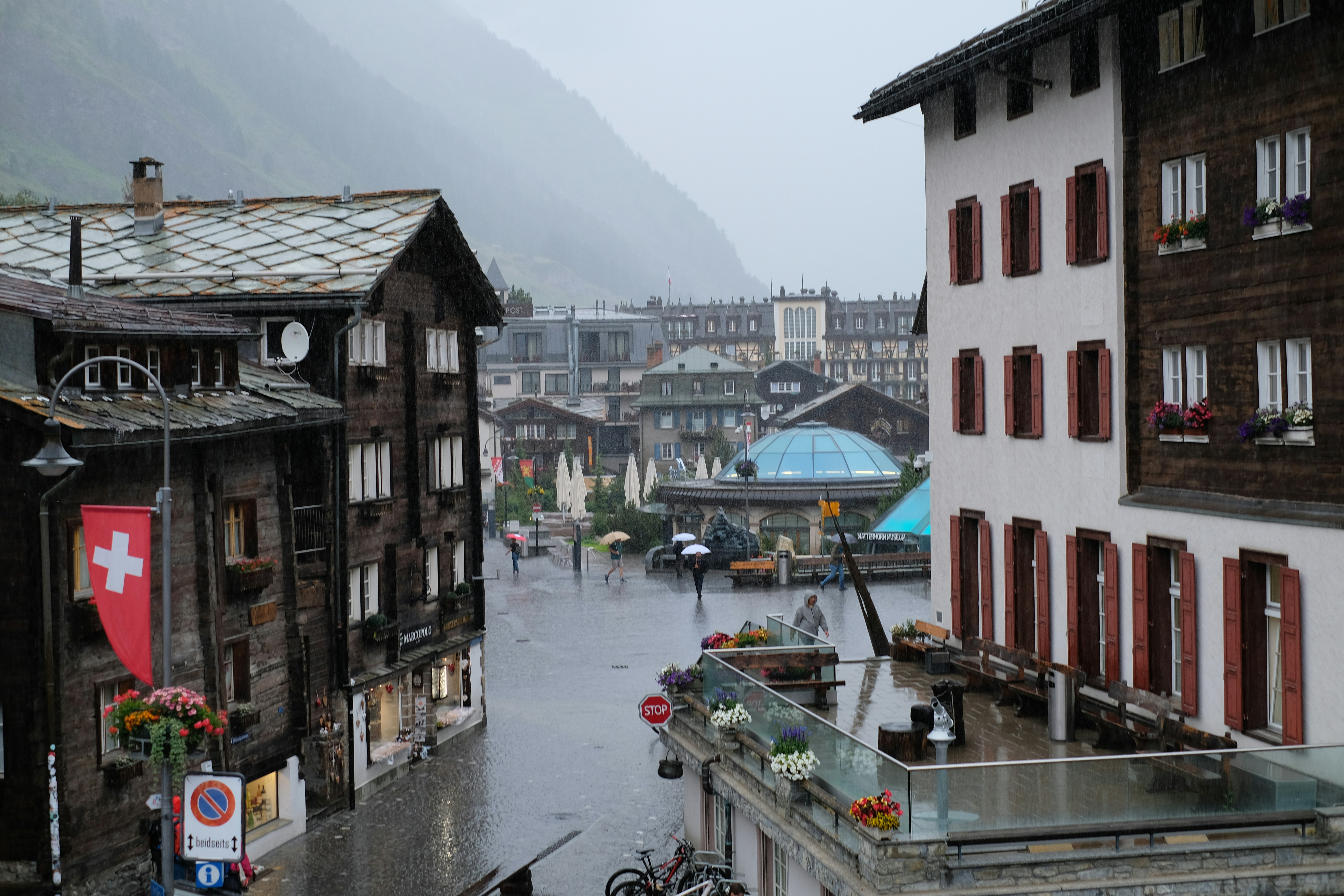 Blue Dome in a Rain-Washed Alpine Street