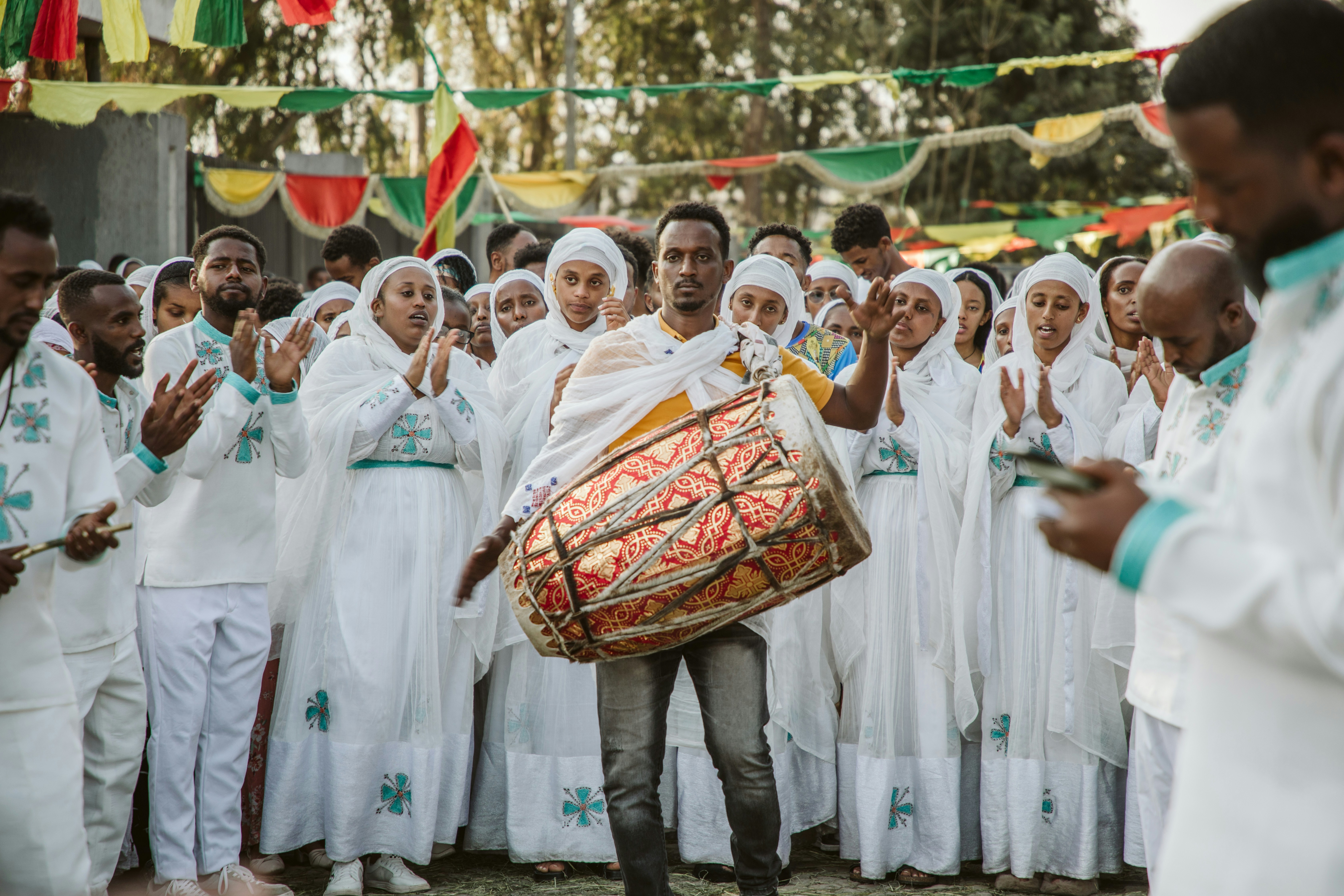 A group of people standing around each other photo – Free Person Image ...
