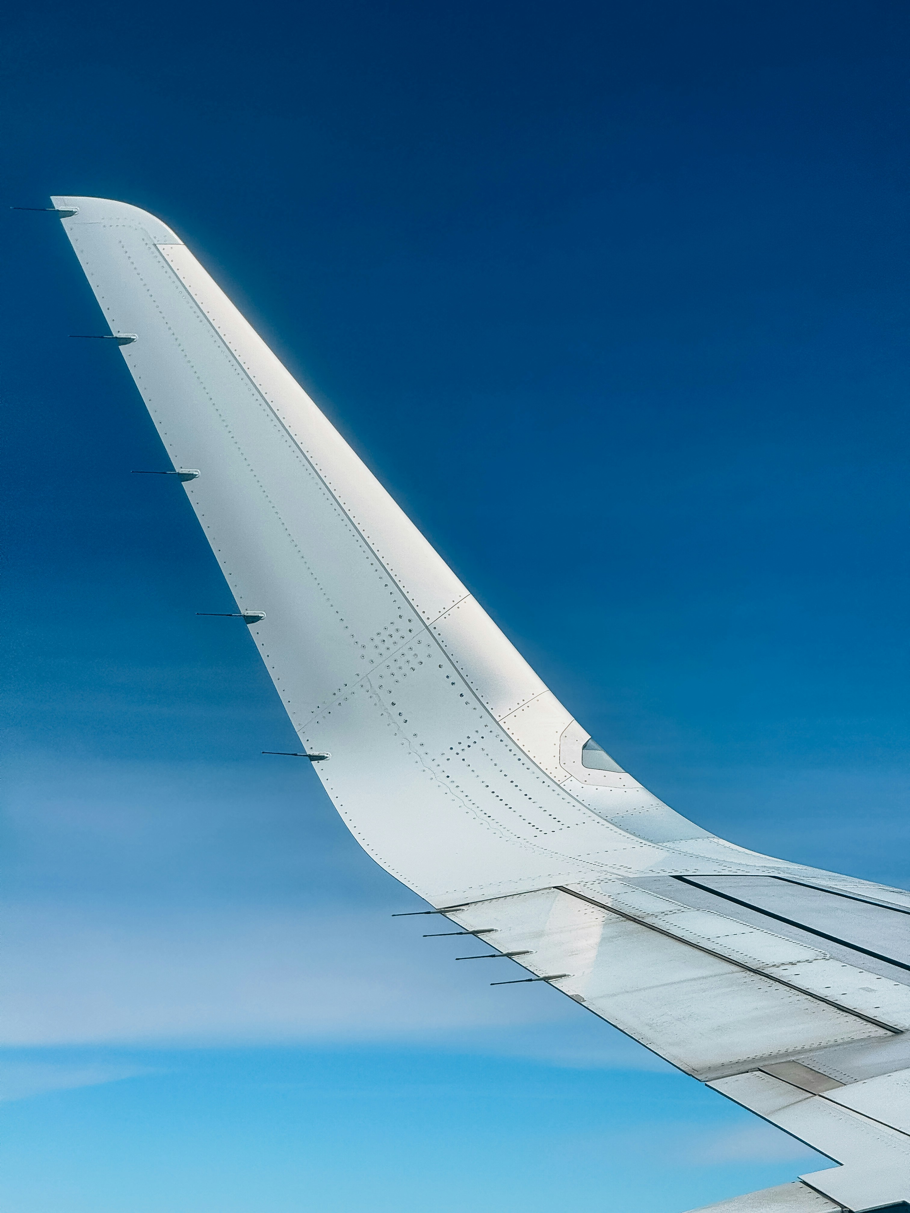 The wing of an airplane flying in the sky photo – Free Aircraft Image ...