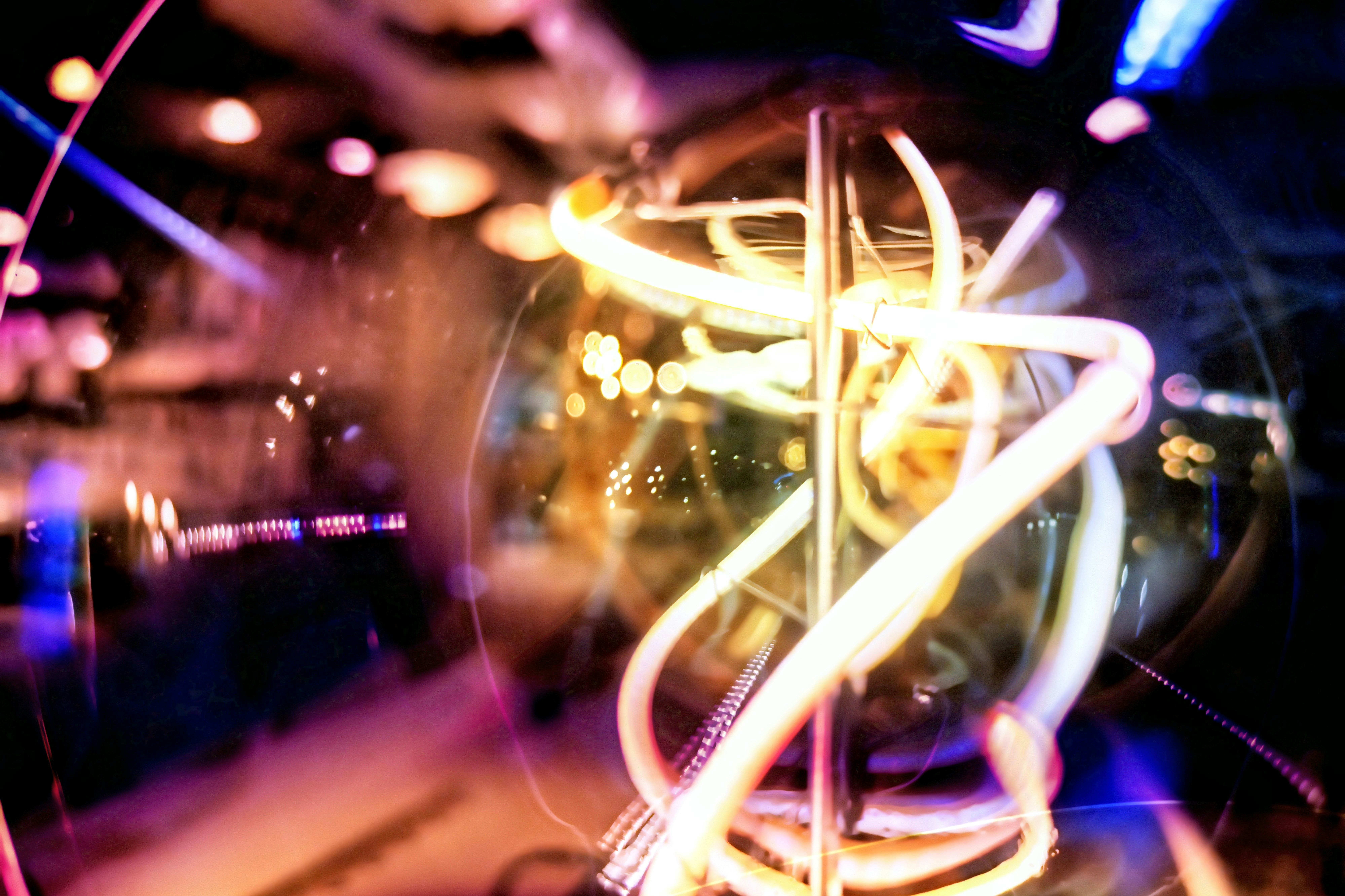 A blurry photo of a clock in a dark room photo – Free Abstract Image on ...