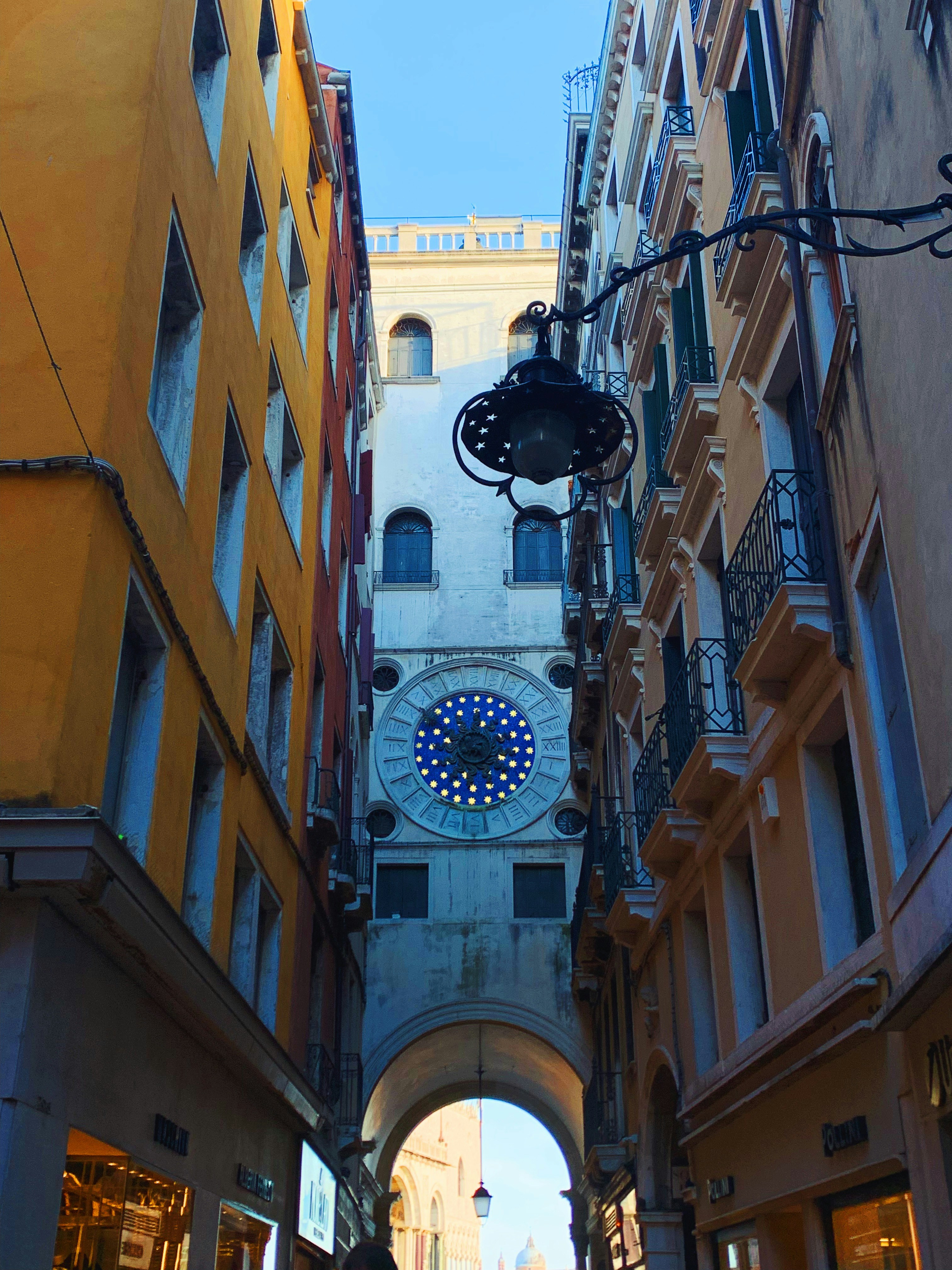 a street with a clock on the side of it