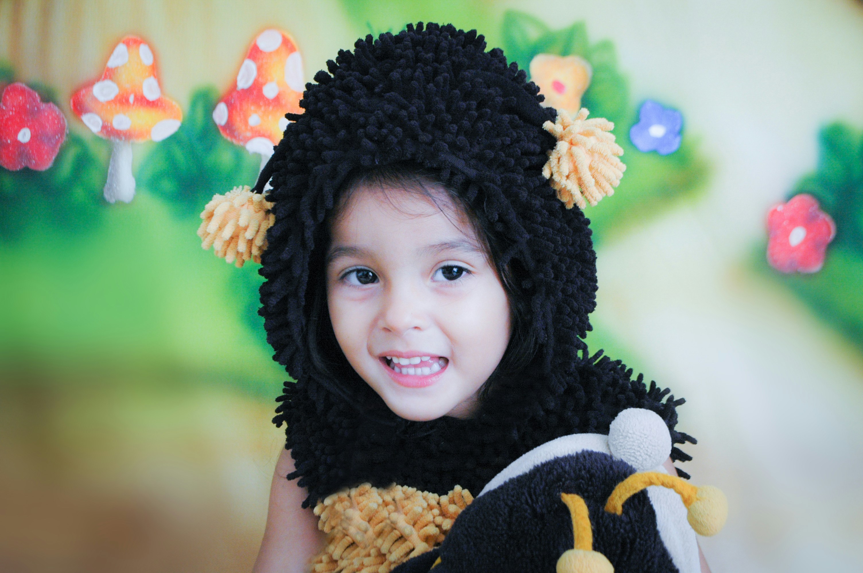 Little Zoo Keeper: A Enchanting Smile in a Plush Hood