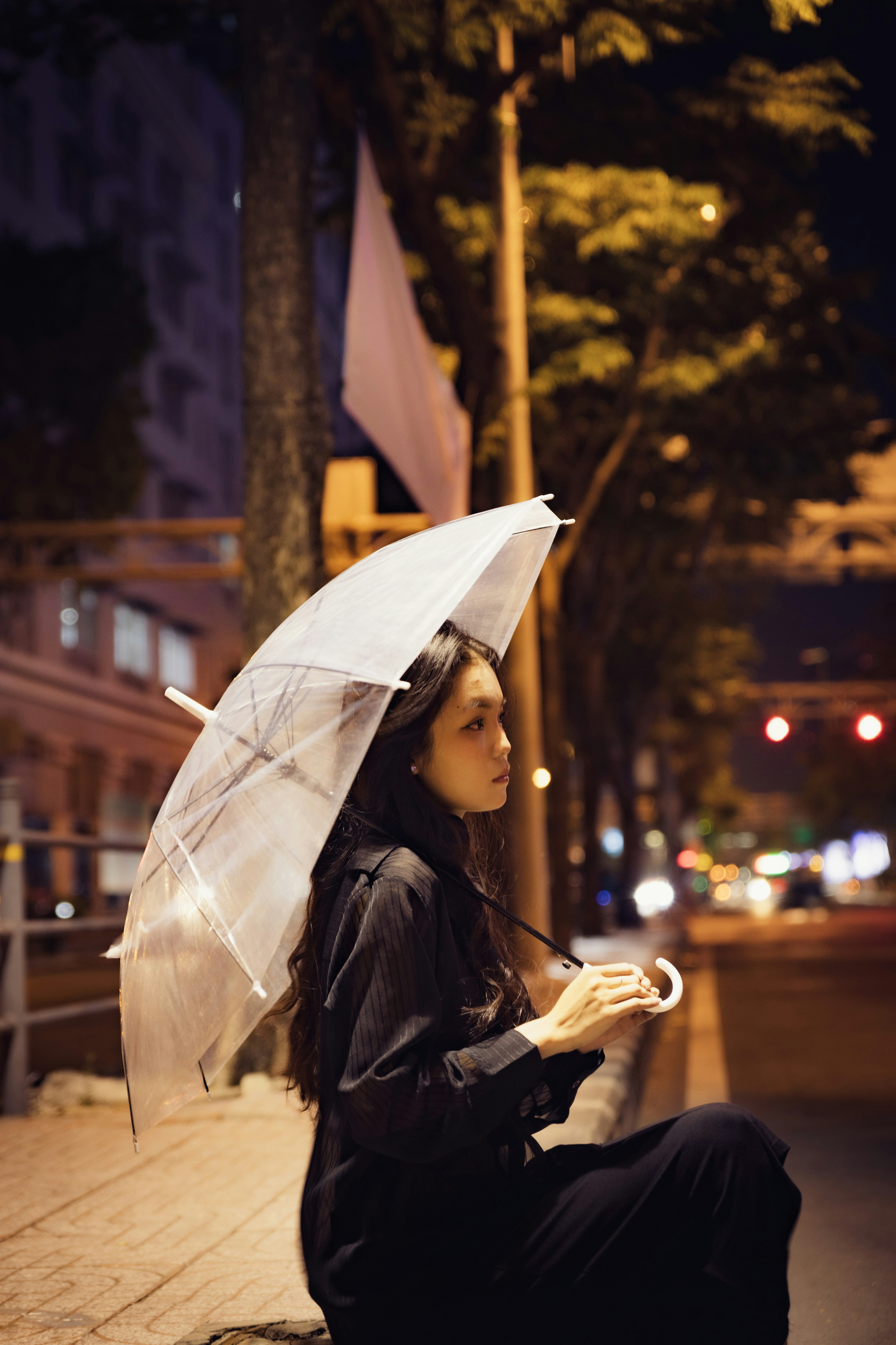 Umbrella Under Neon: A Quiet Night Portrait