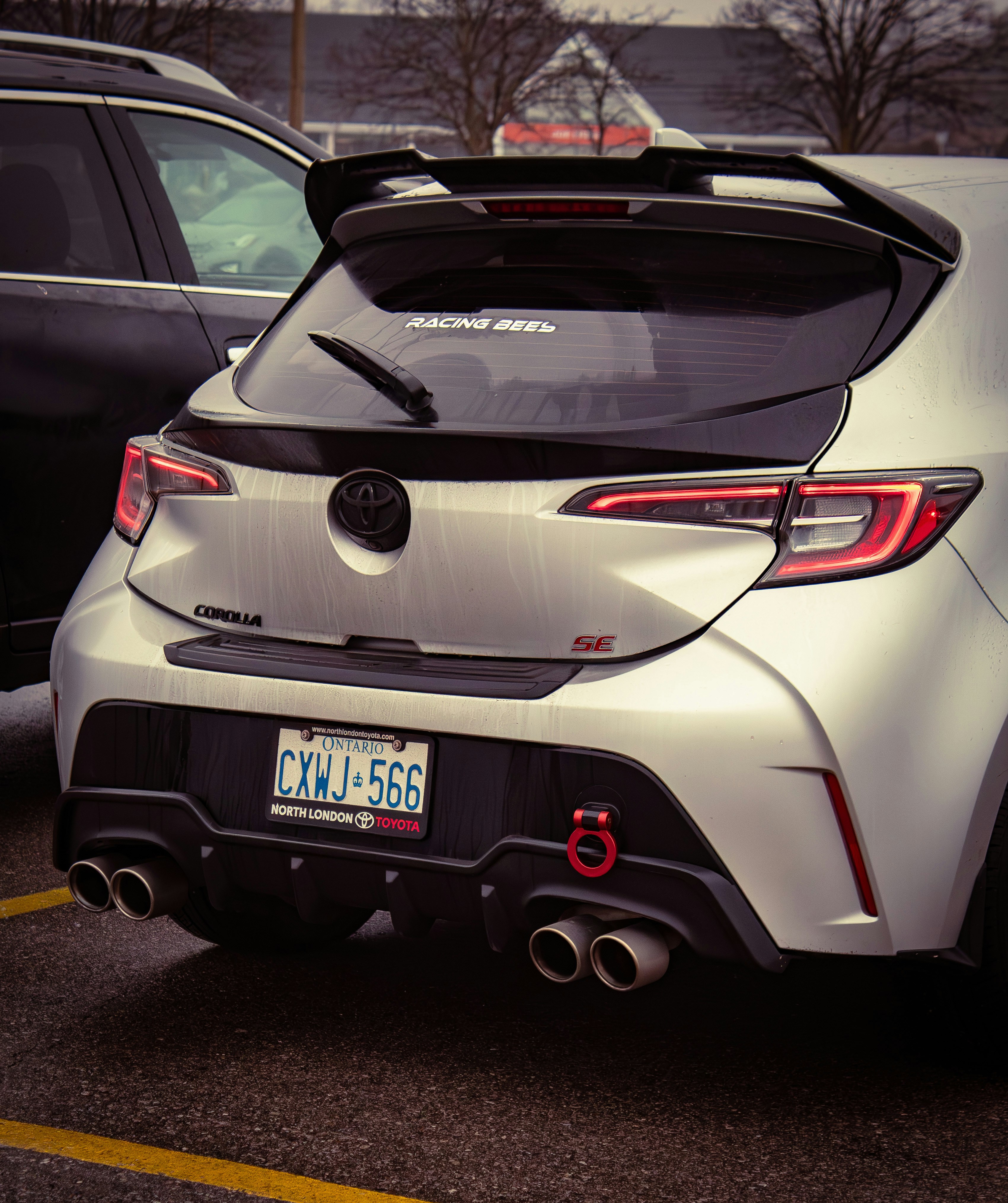 Ontario Night Riser: Quad-Exhausted White Sport Hatch with Red Tow Hook