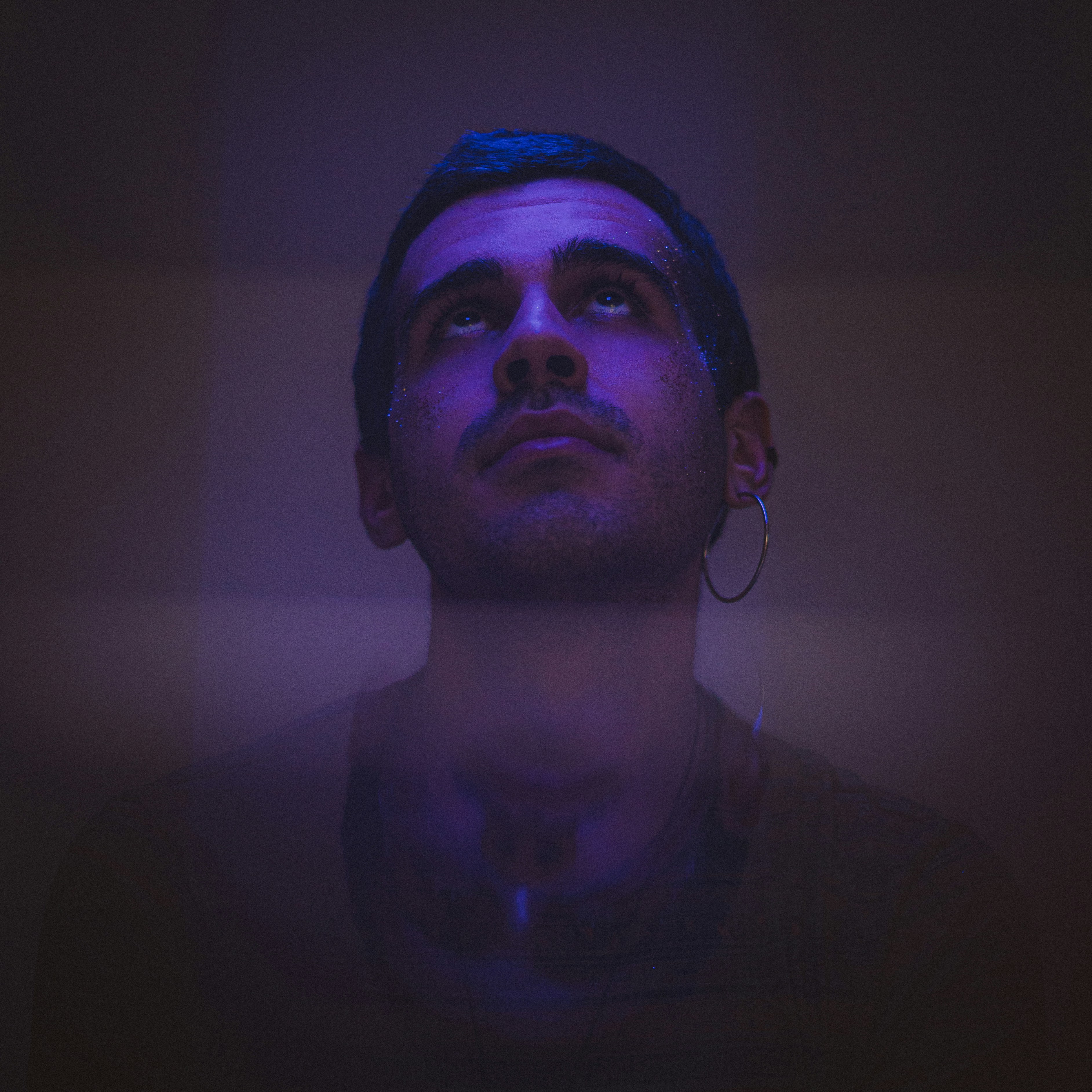 Gaze Toward the Neon Sky: A Portrait Bathed in Violet