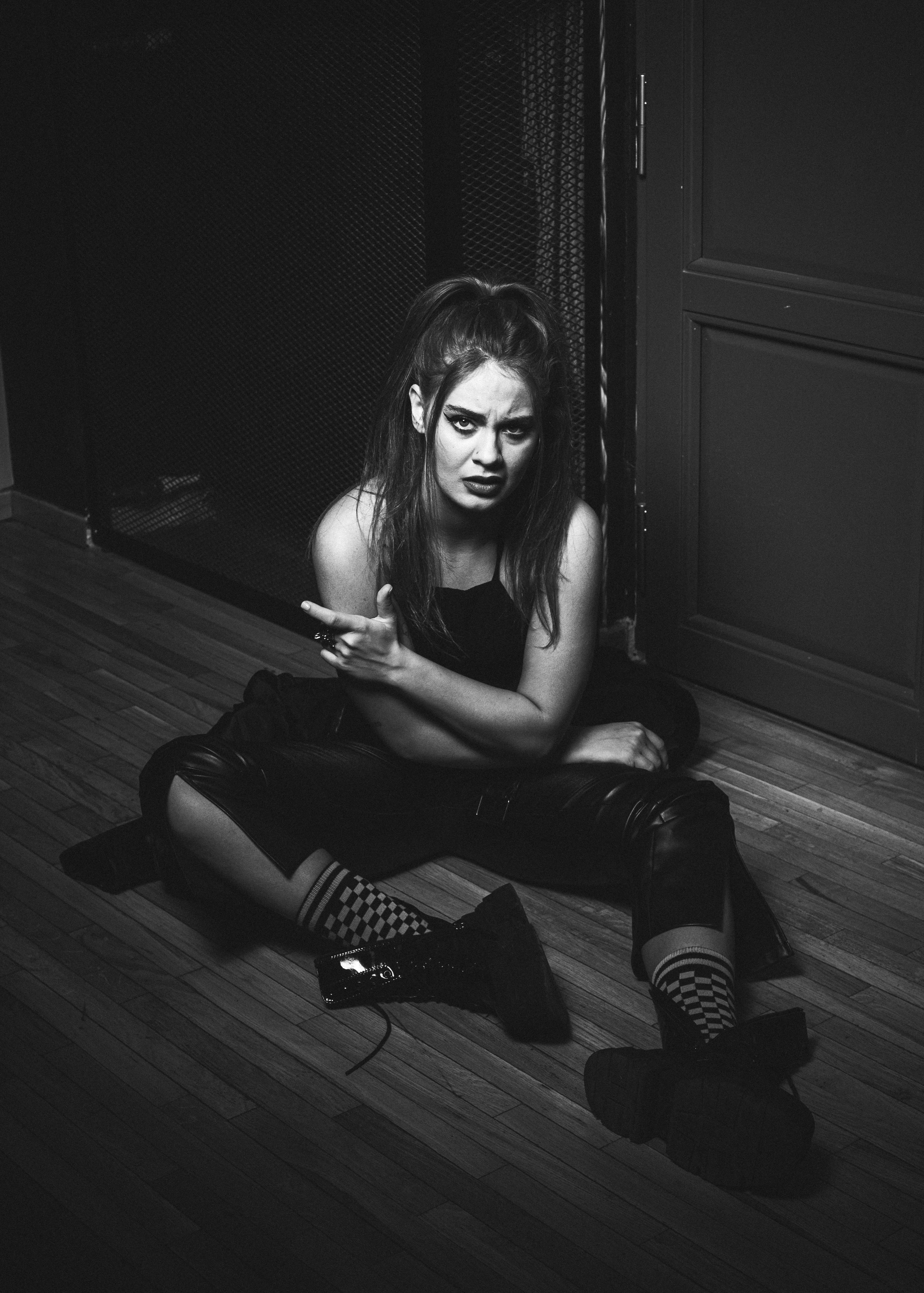 Gloom Gaze: A Black-and-White Portrait in Leather and Light