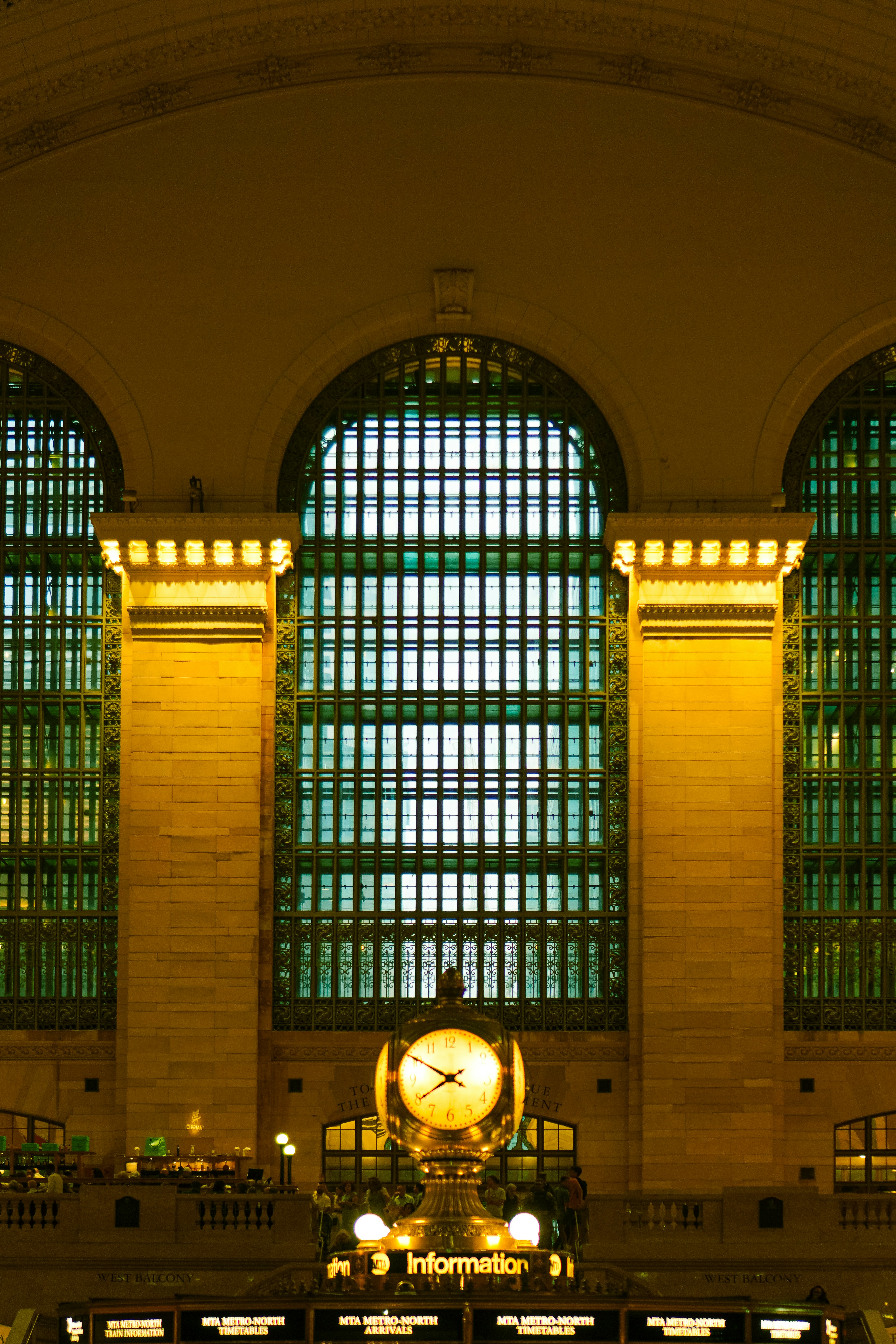 Midnight Clock at Grand Hall: A silhouette beneath towering arched windows