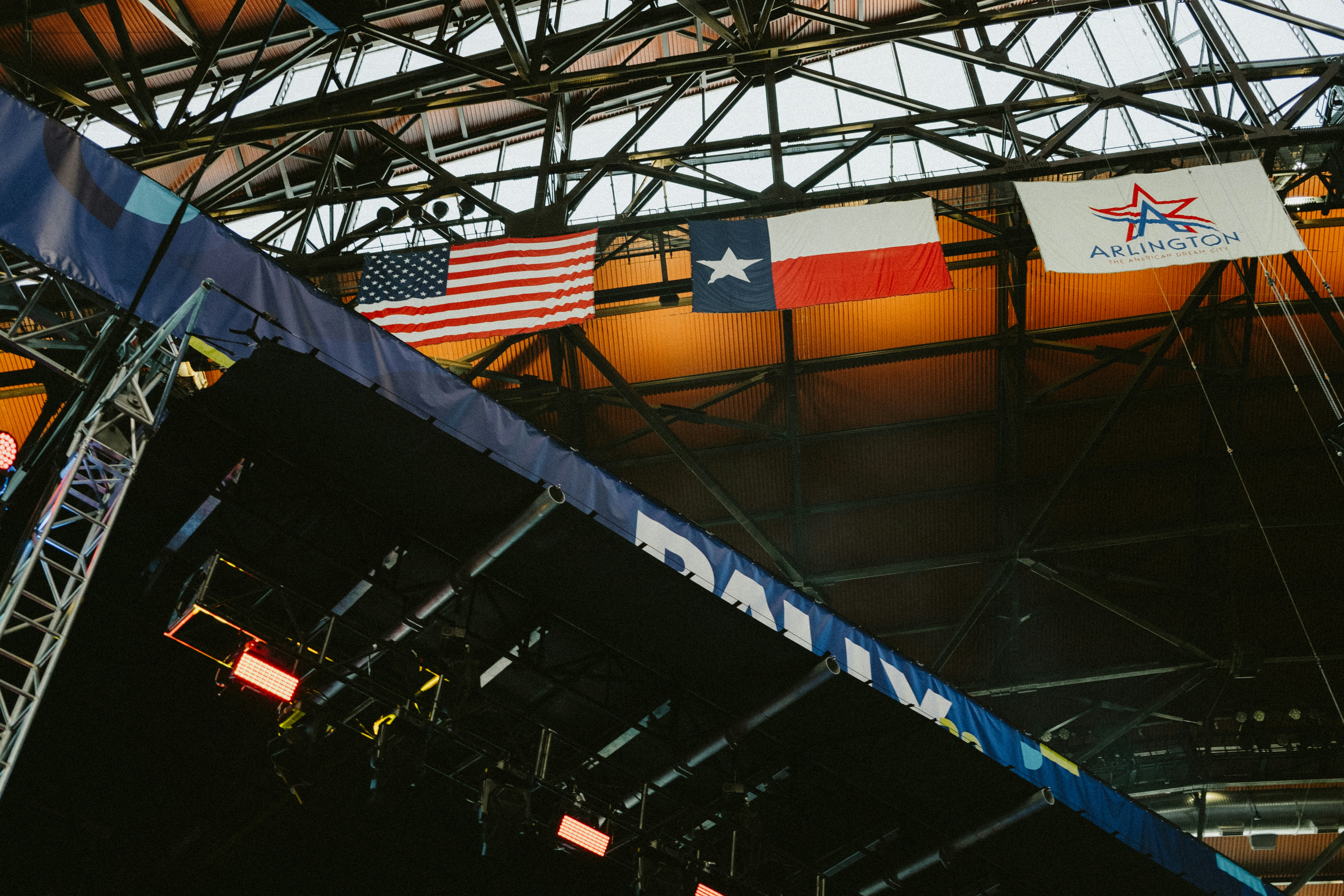 A group of flags hanging from the ceiling of a building photo – Free ...