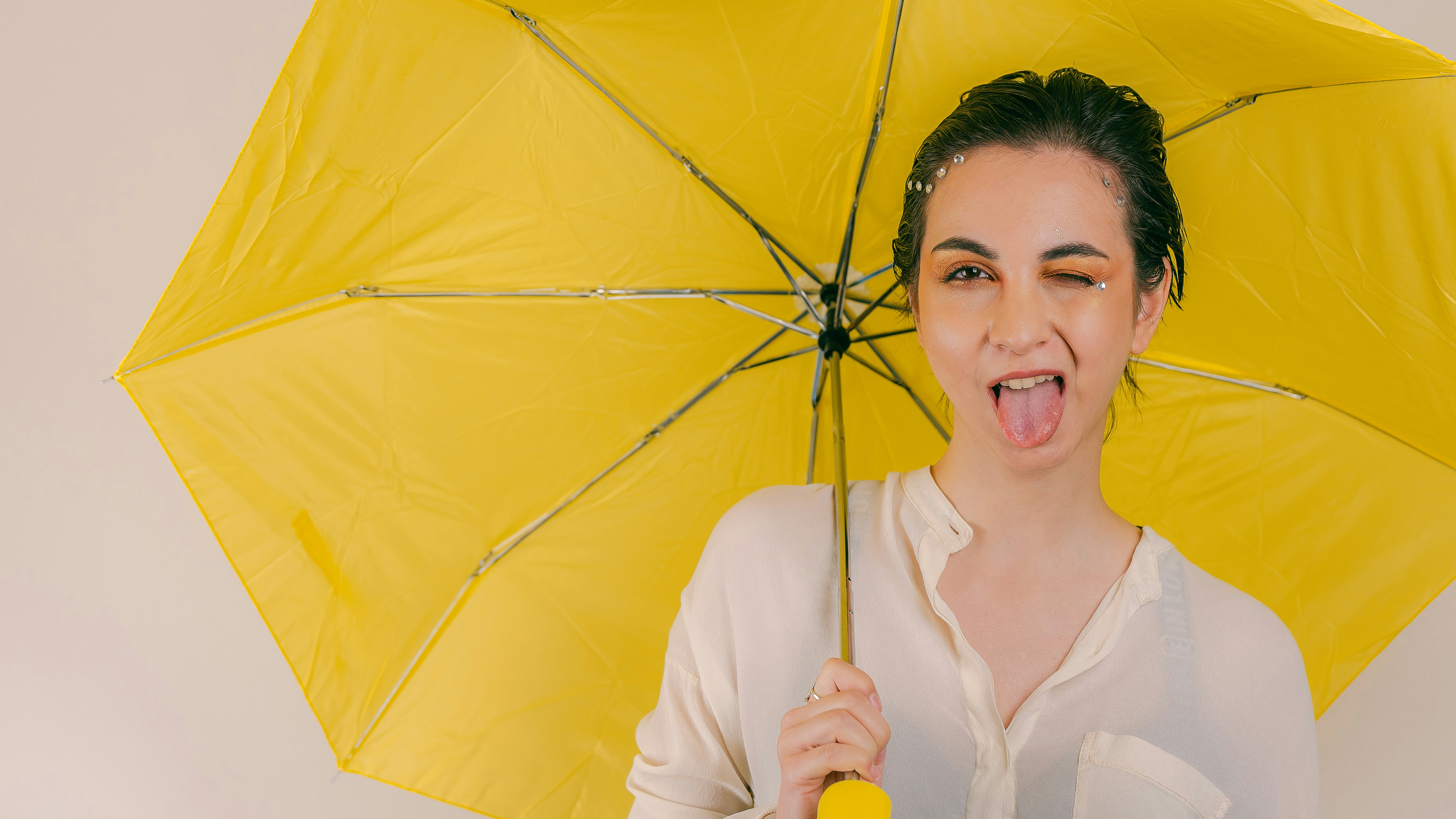 Yellow Umbrella centerpiece: playful portrait with a cheeky wink