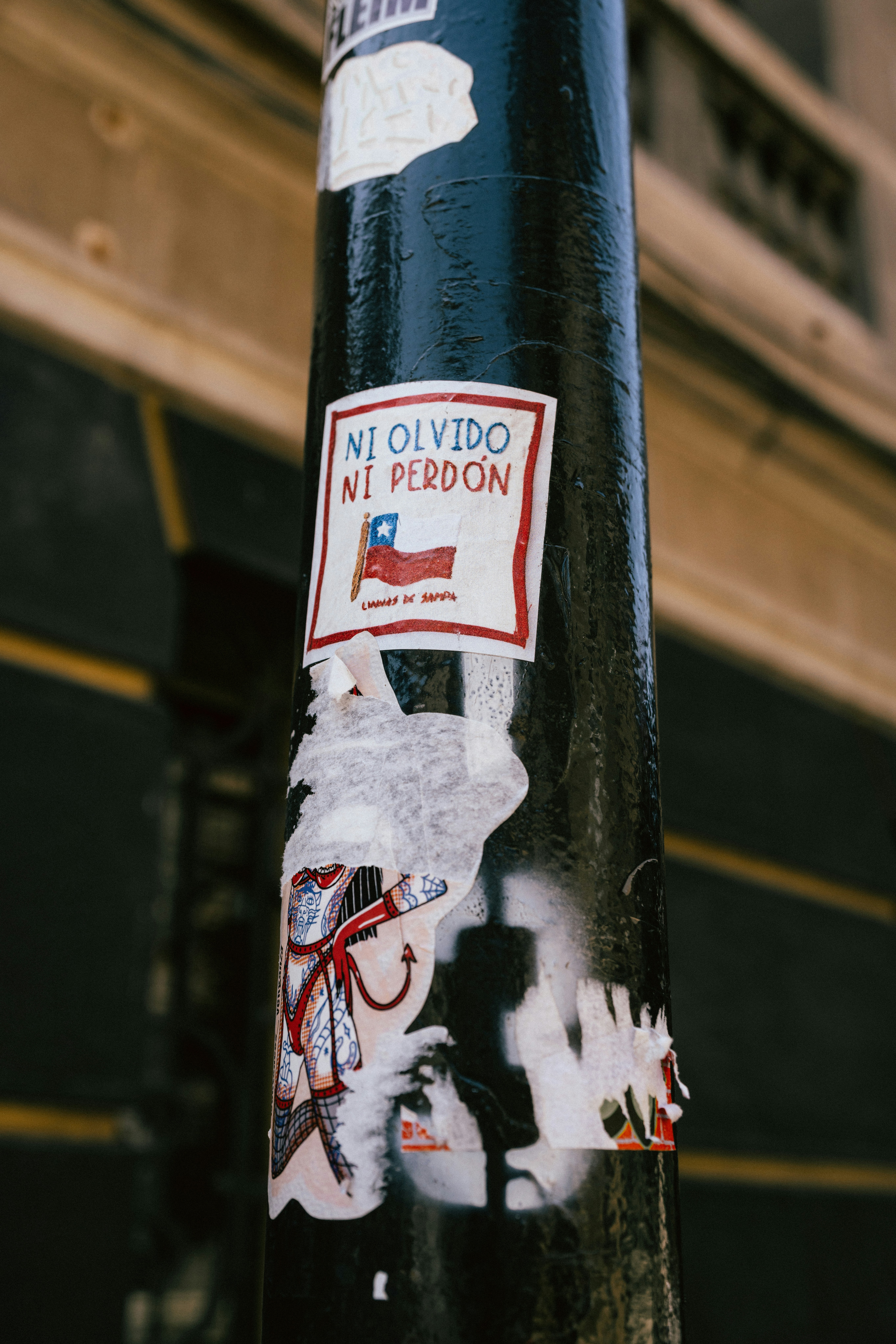 Stickered Post: A Towering Pole Adorned with Chilean Pride