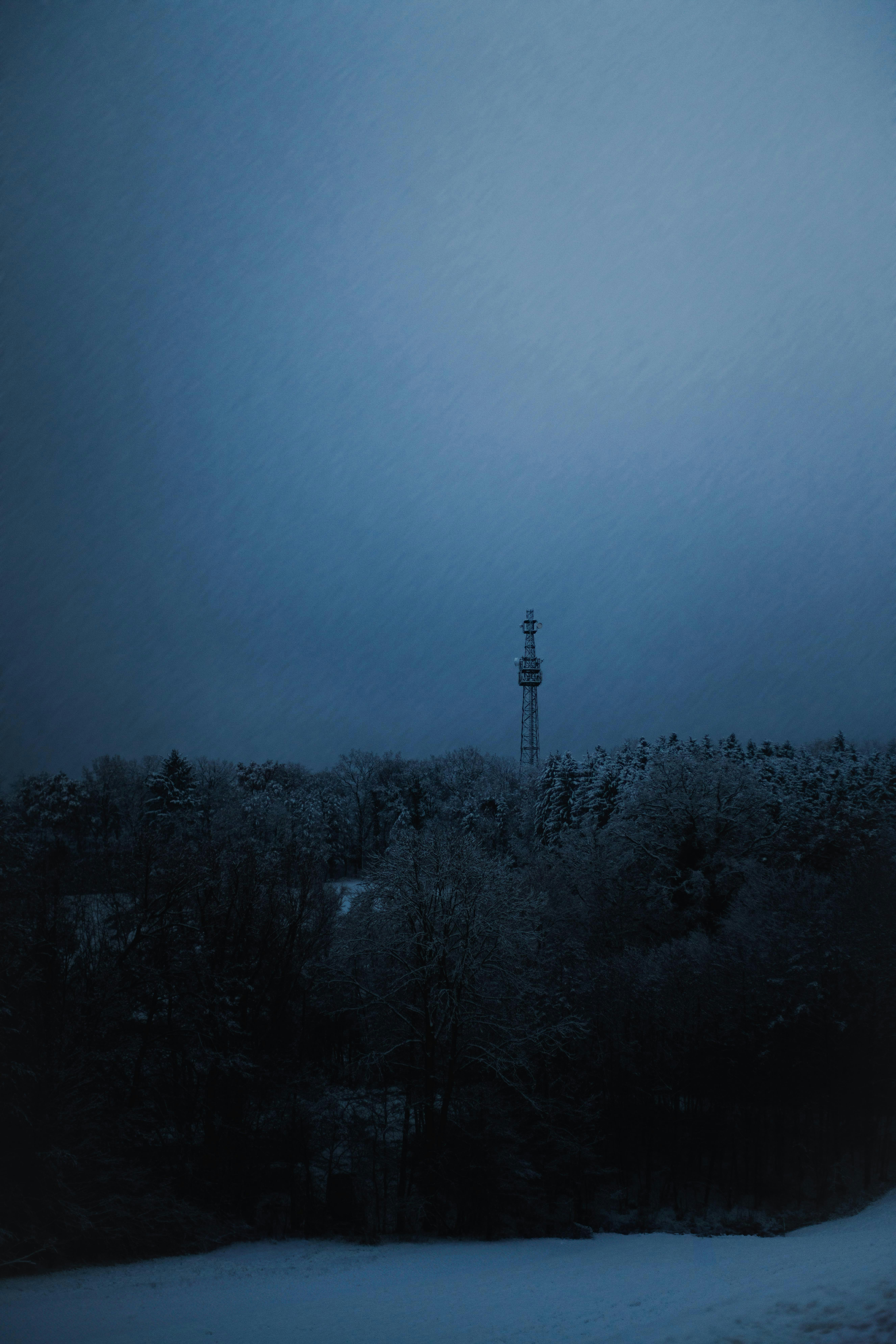 Blue Hour Signal: A Snowbound Ridge and a Lone Cell Tower