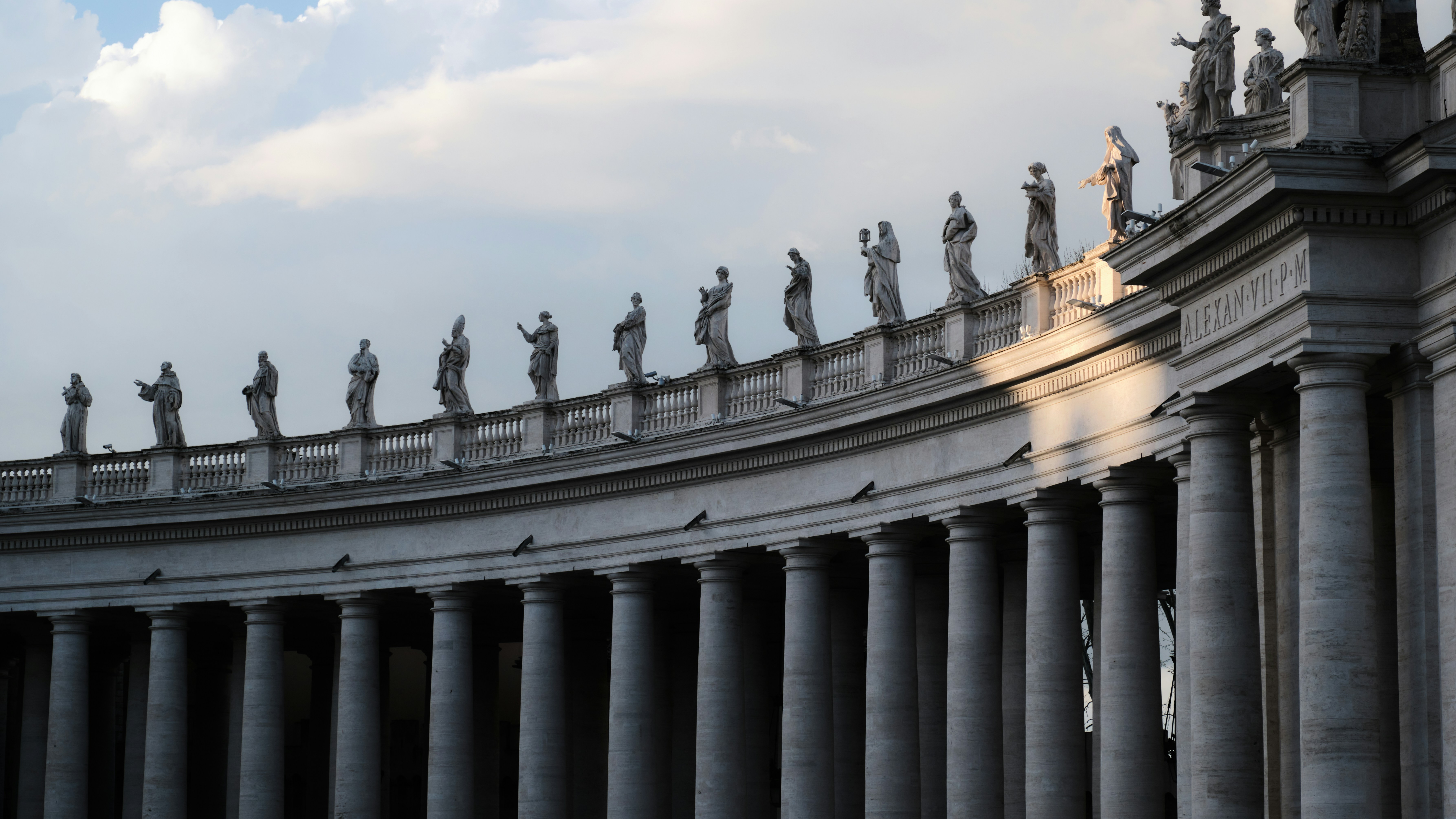 A group of statues on top of a building photo – Free Vatican city Image ...