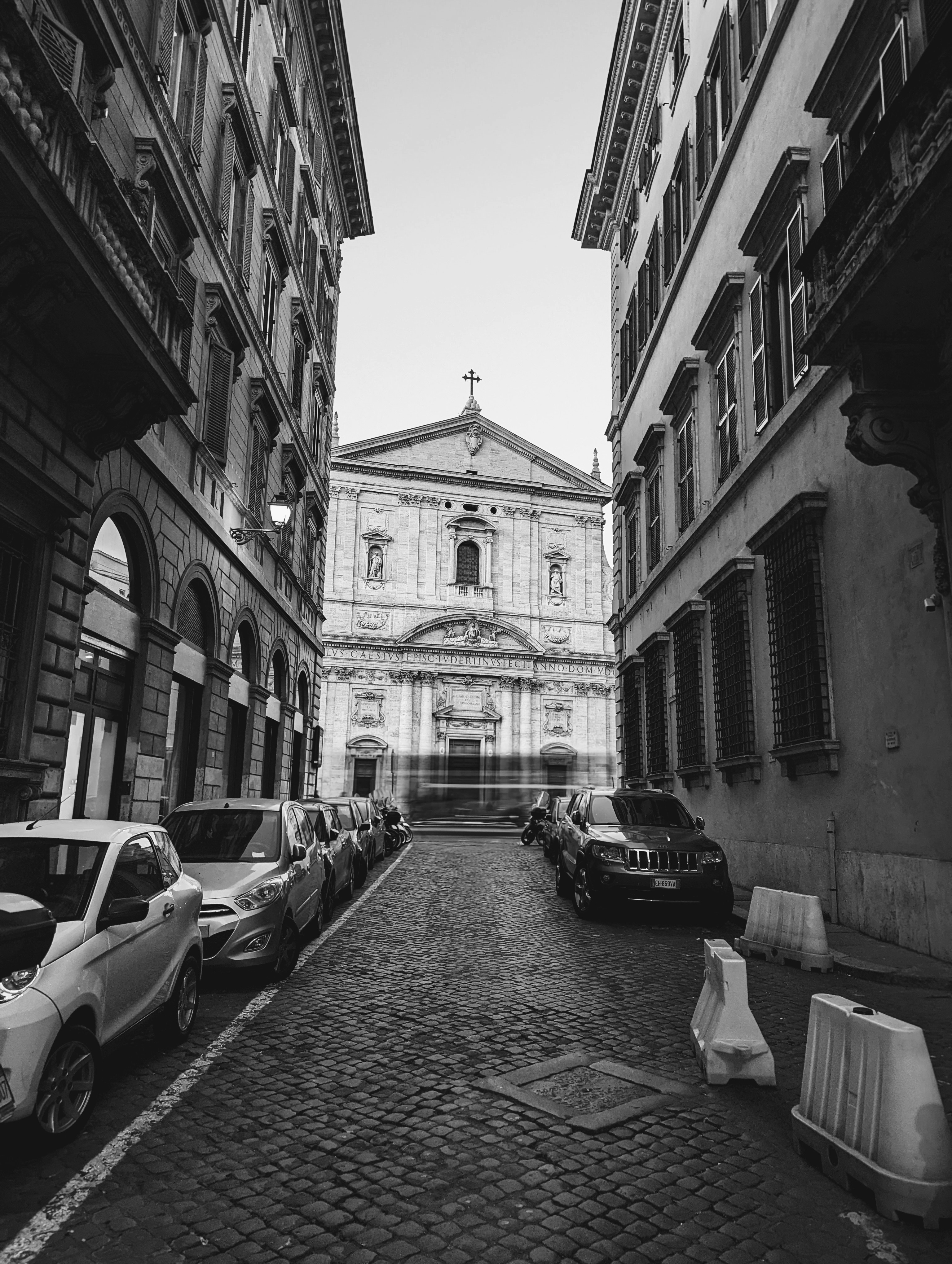Cobblestone Corridor to a Central Cathedral