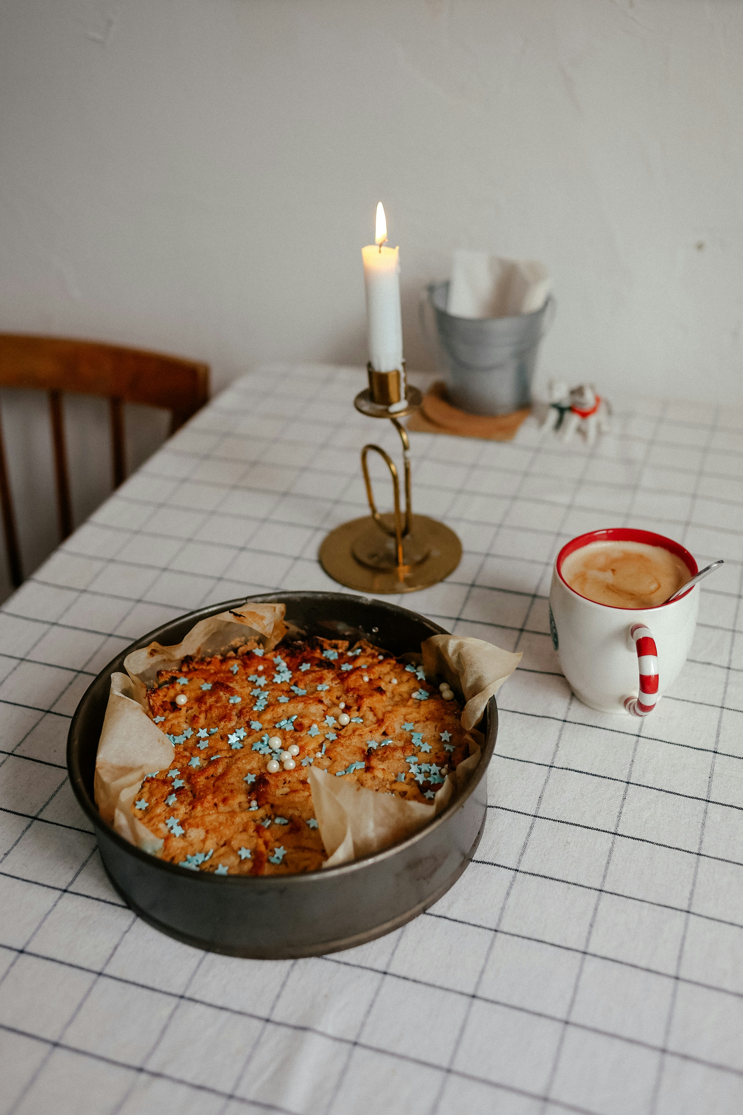 Blue Star Sprinkles Under Candlelight on a Checkered Table