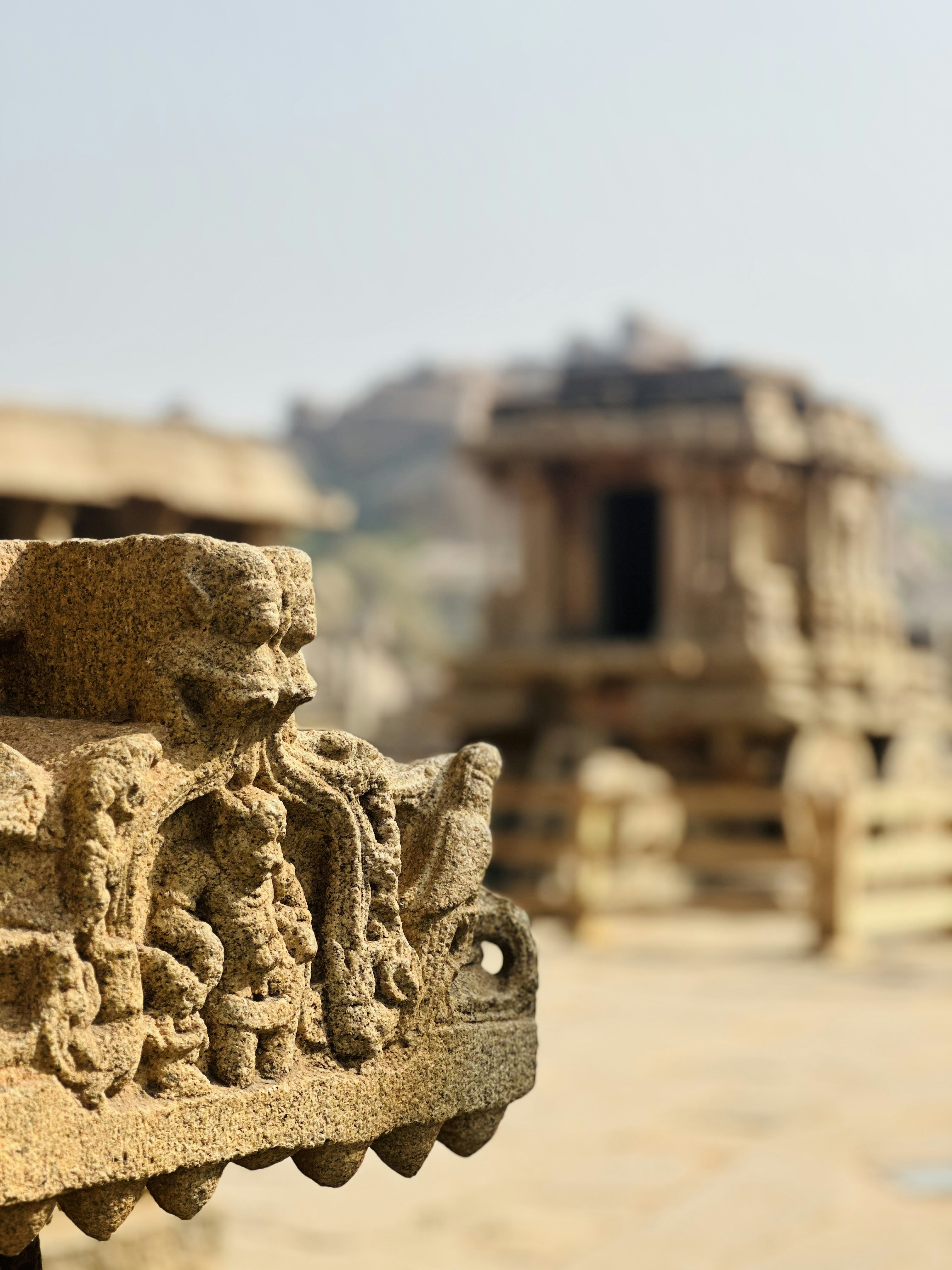 Carved Sentinel: Stone Dragon in Focus, Temple in the Distance
