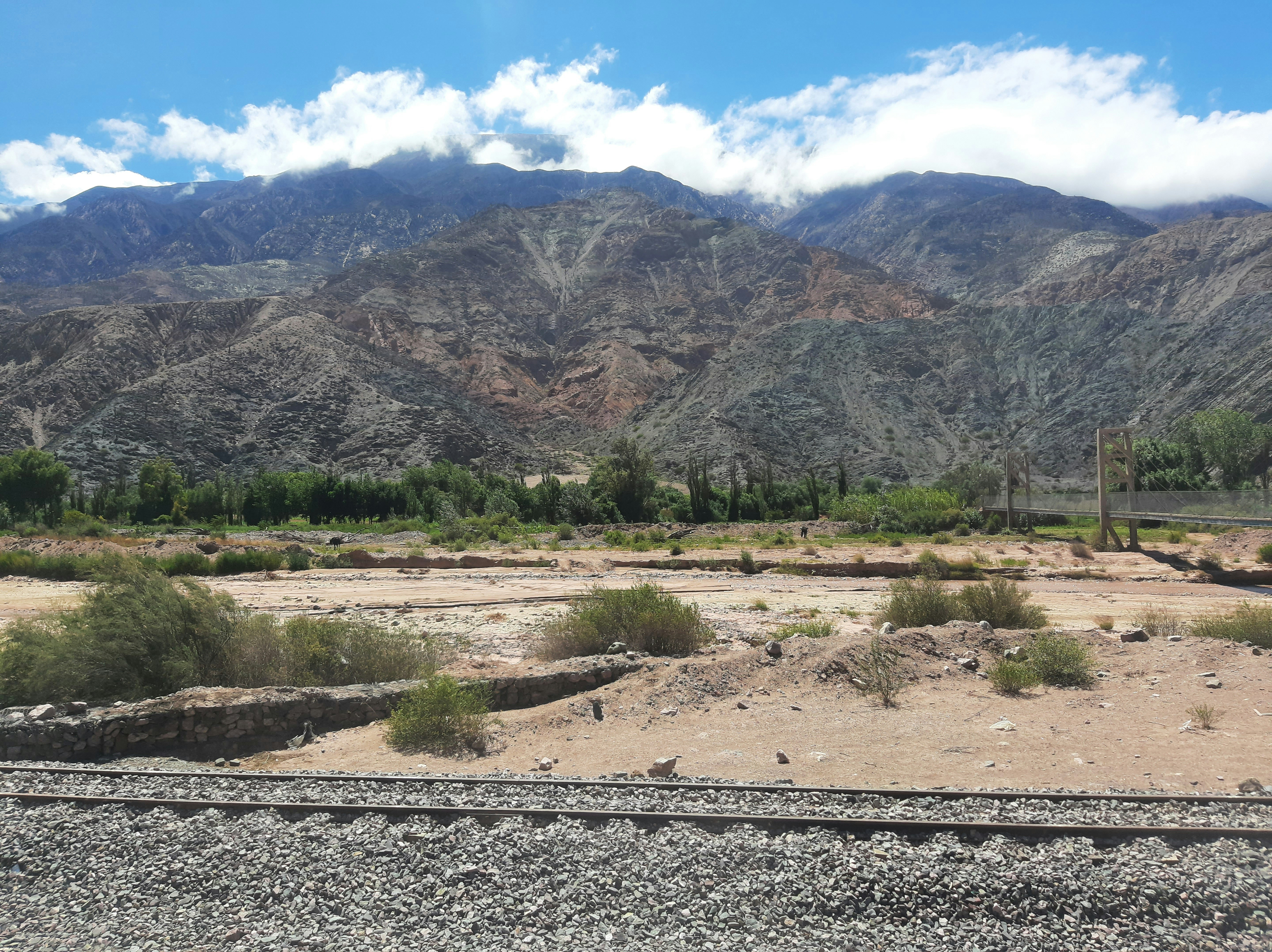 Desert Rails Framing a Rugged Mountain Horizon