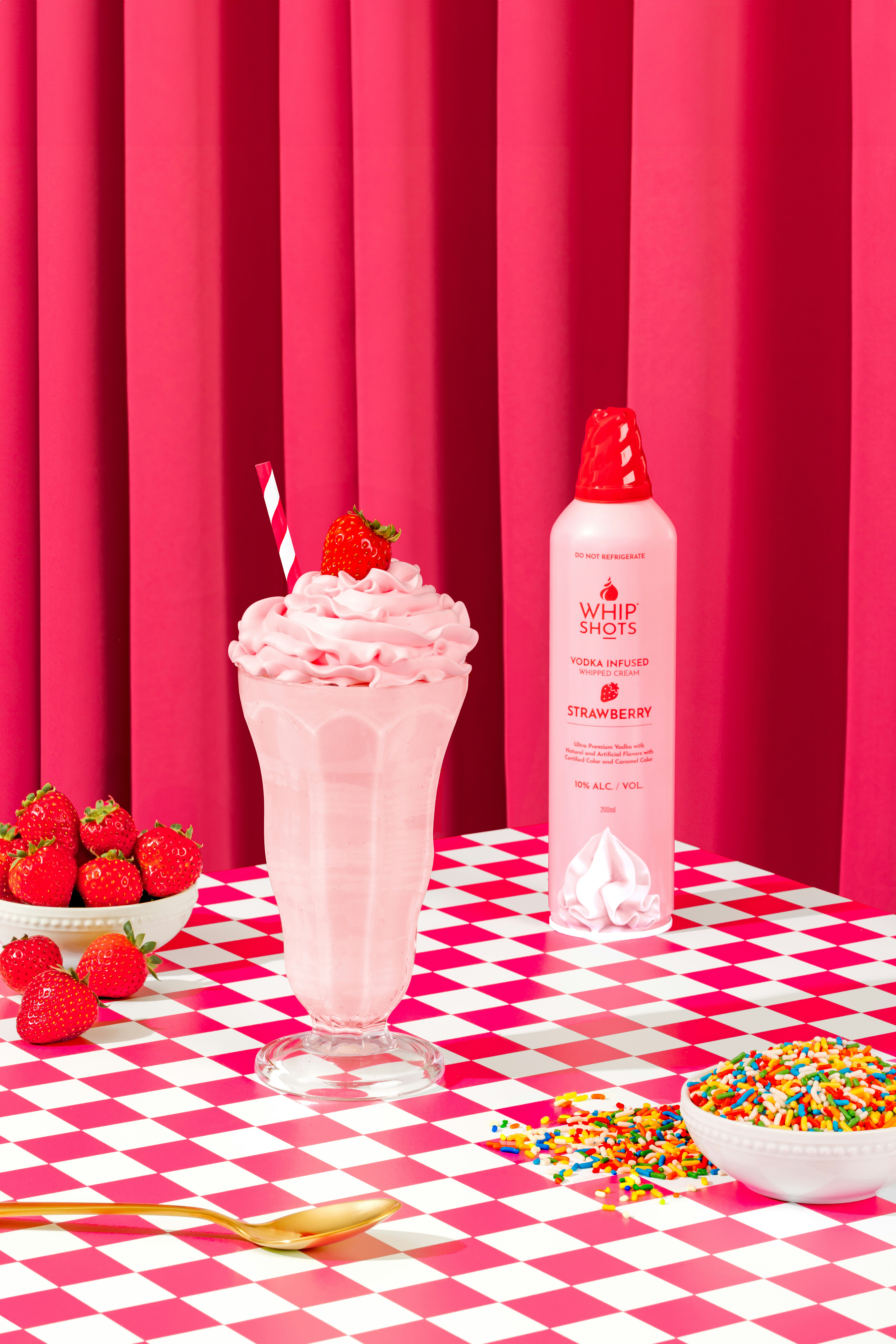 A table topped with a milkshake and a bowl of strawberries photo – Free ...