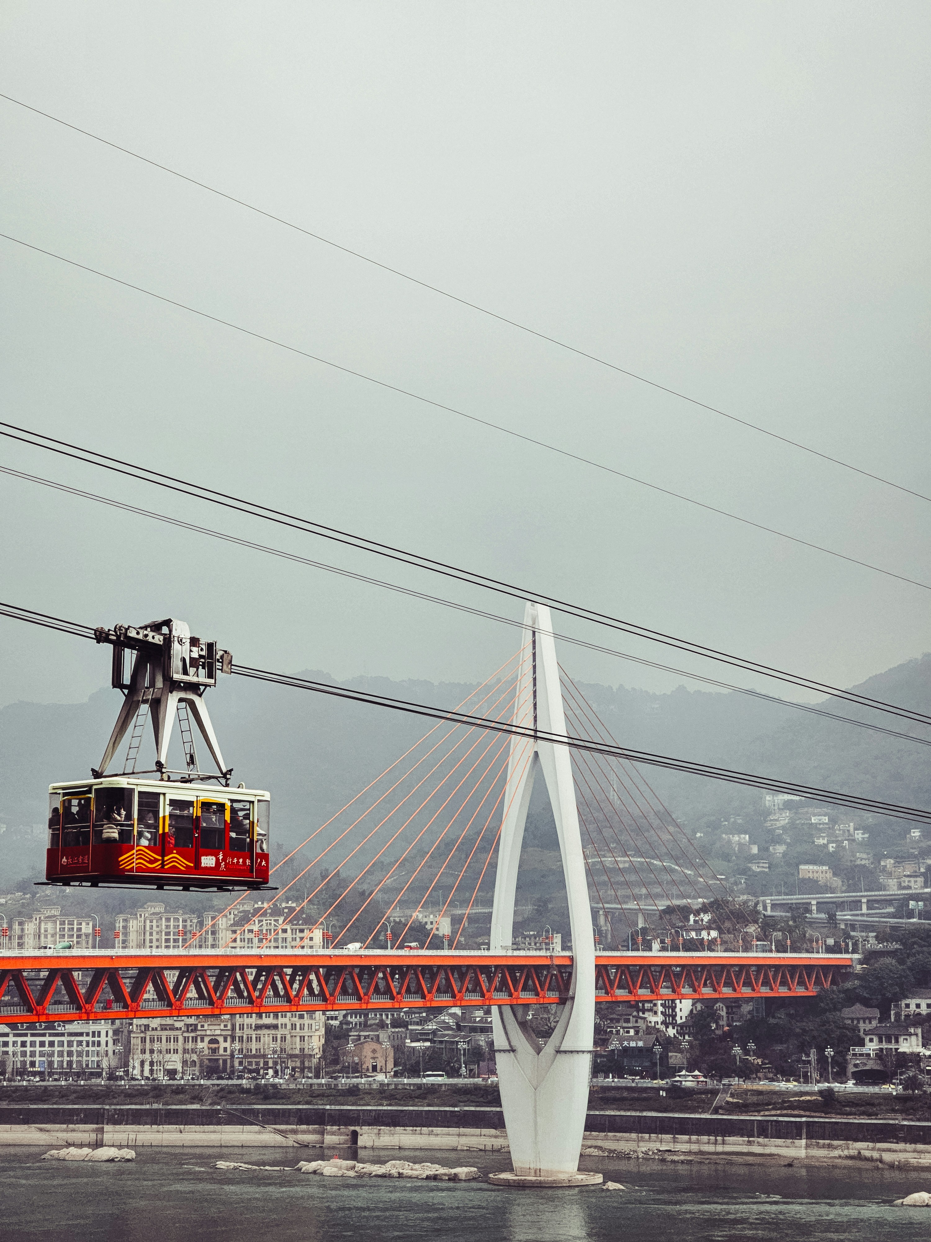 A cable car is going over a bridge photo – Free Travel Image on Unsplash