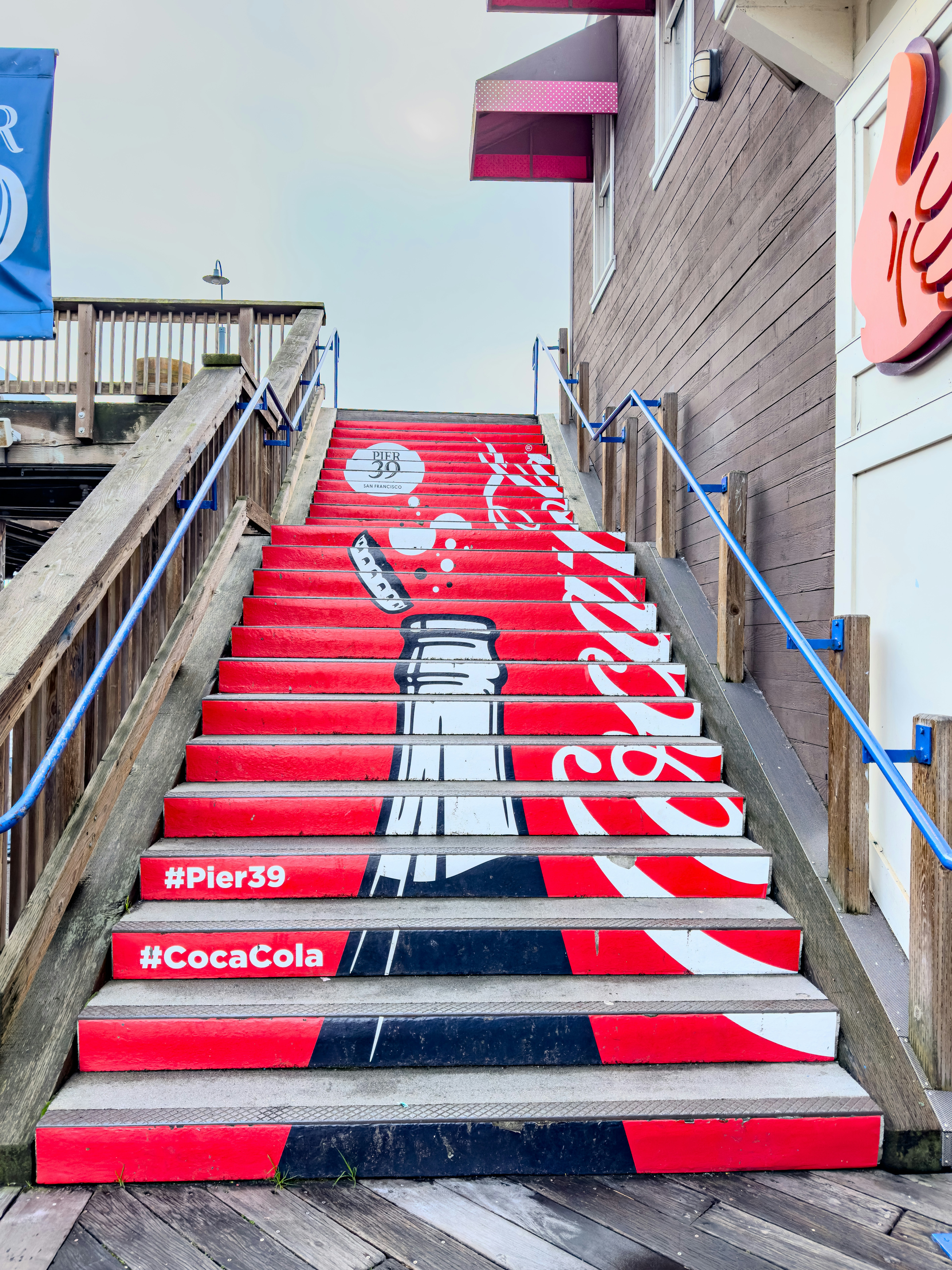 Vibrant Coca-Cola Staircase: A Coastal Pier Flashback