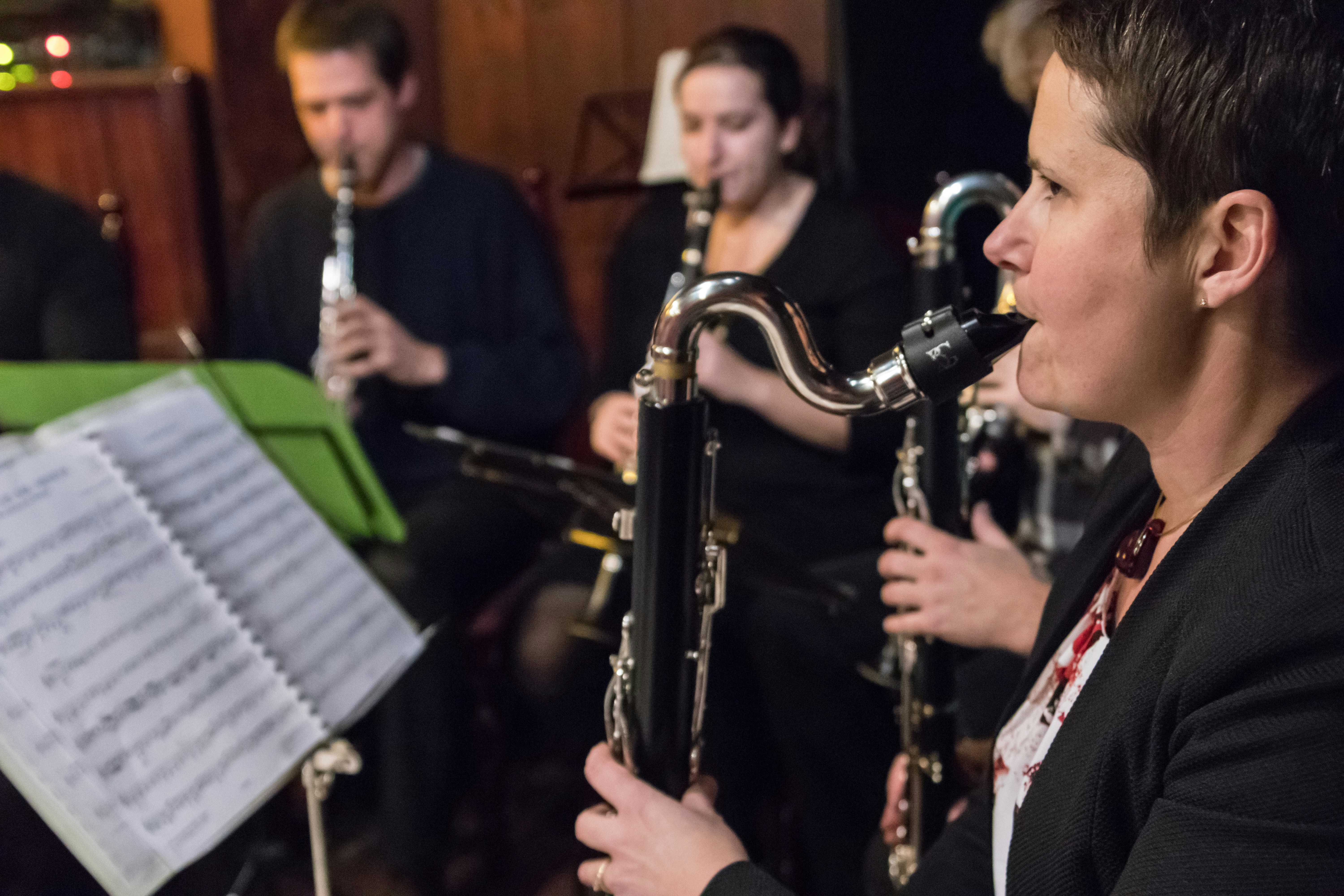 A group of people playing musical instruments in a room photo – Free ...