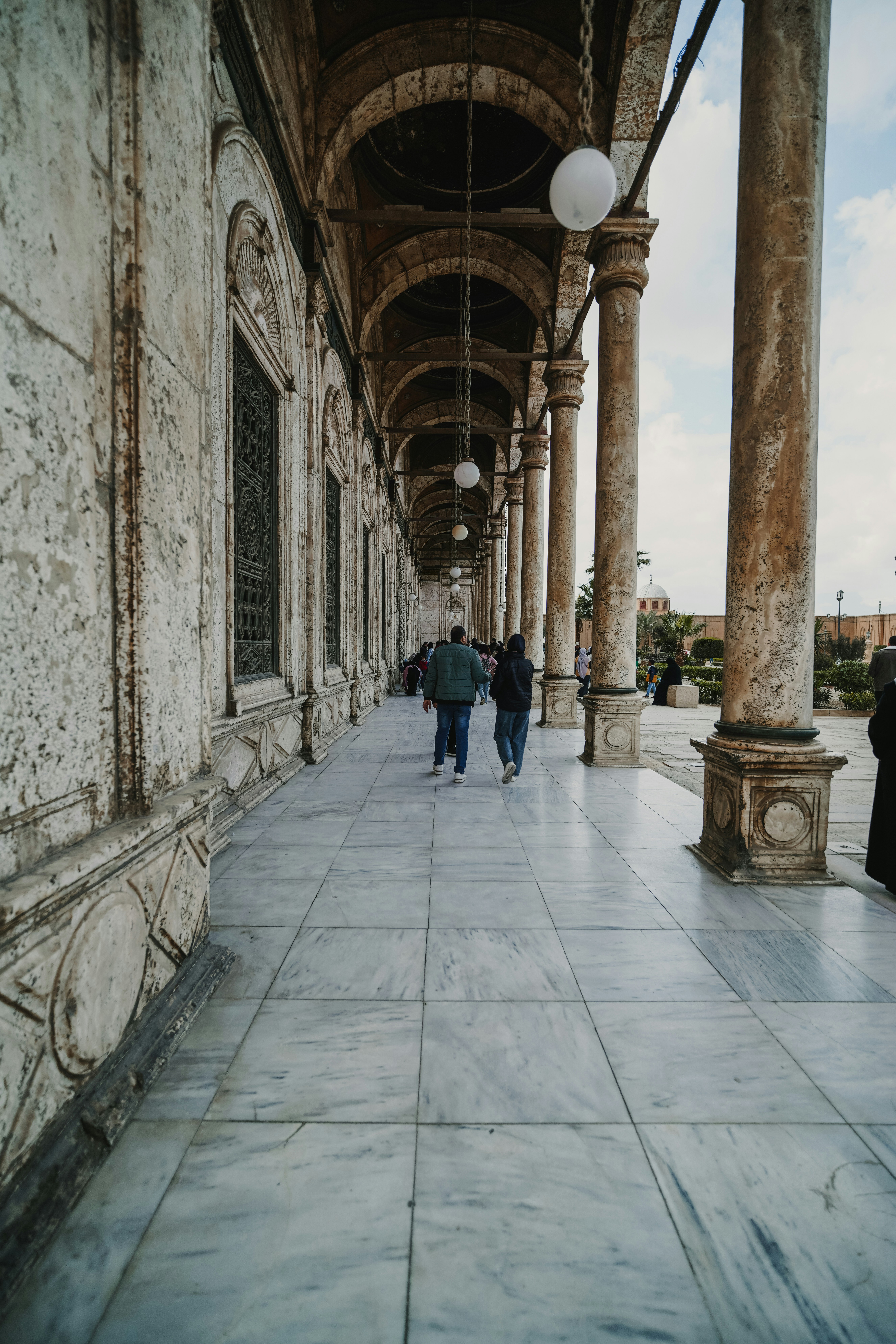 Marble Colonnade: A Quiet Walk Beneath Receding Arches