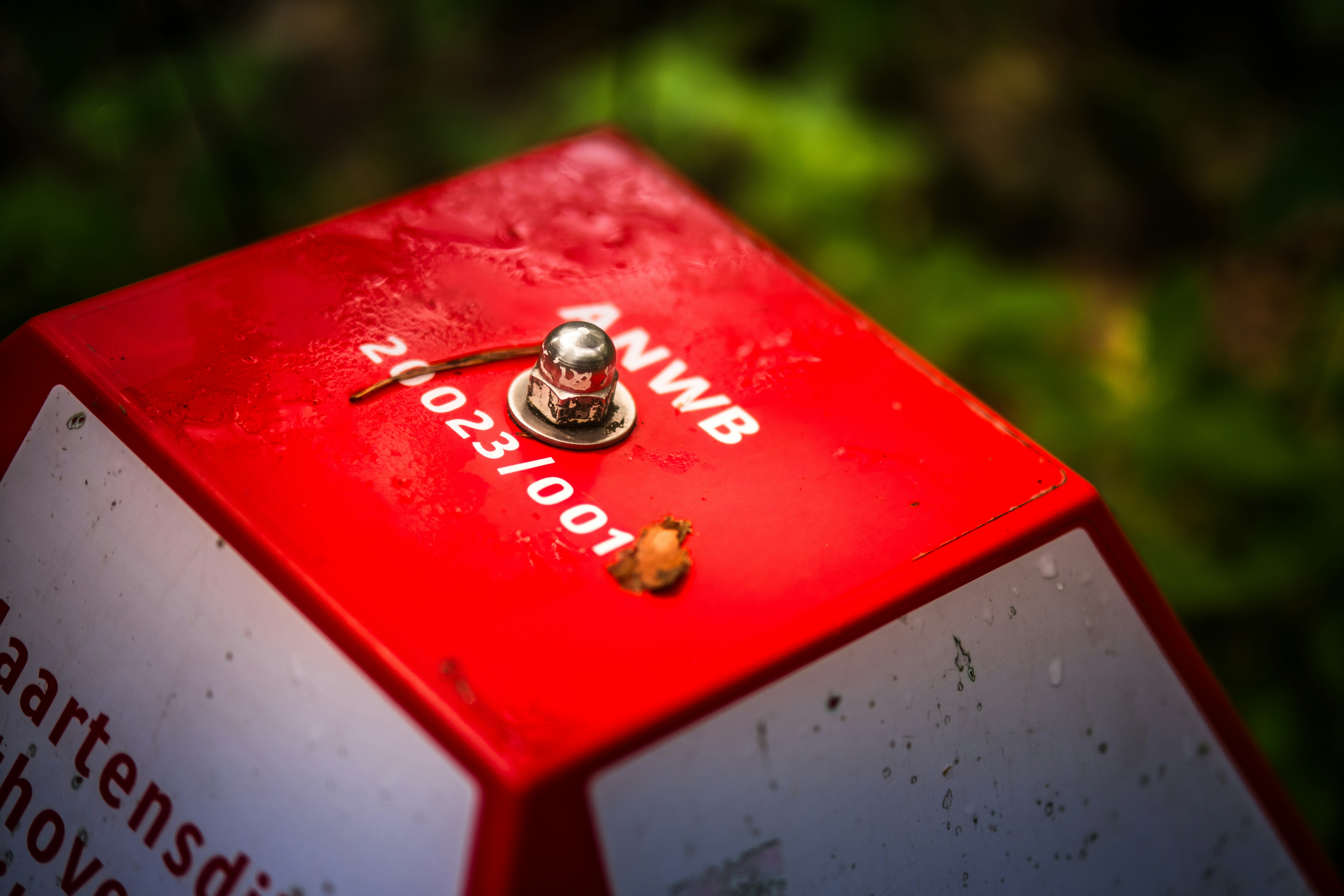 A close up of a red stop sign with a button on it photo – Free Box ...