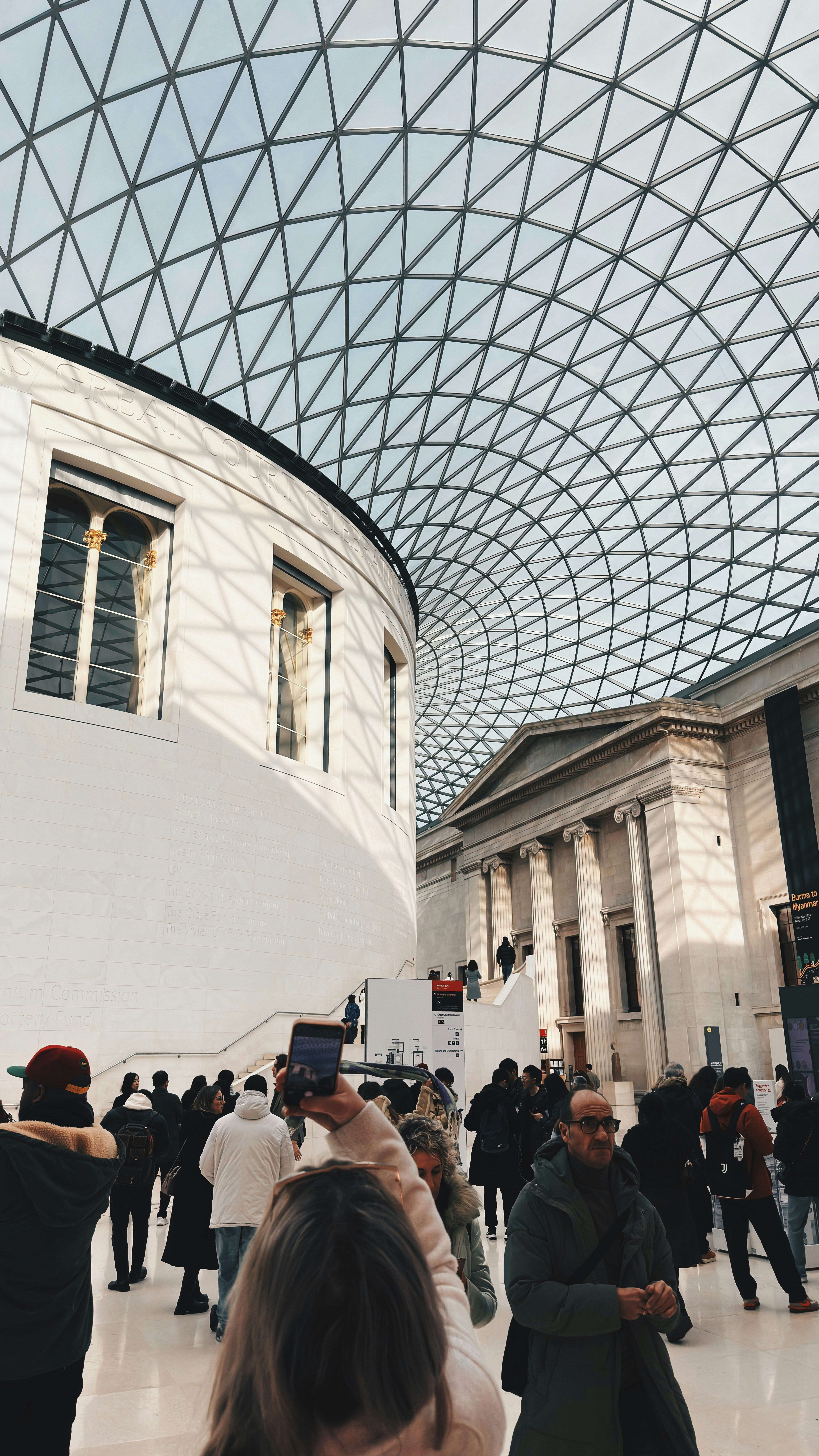 Diamond Grid Atrium: Crowds Beneath a Marble and Glass Cathedral