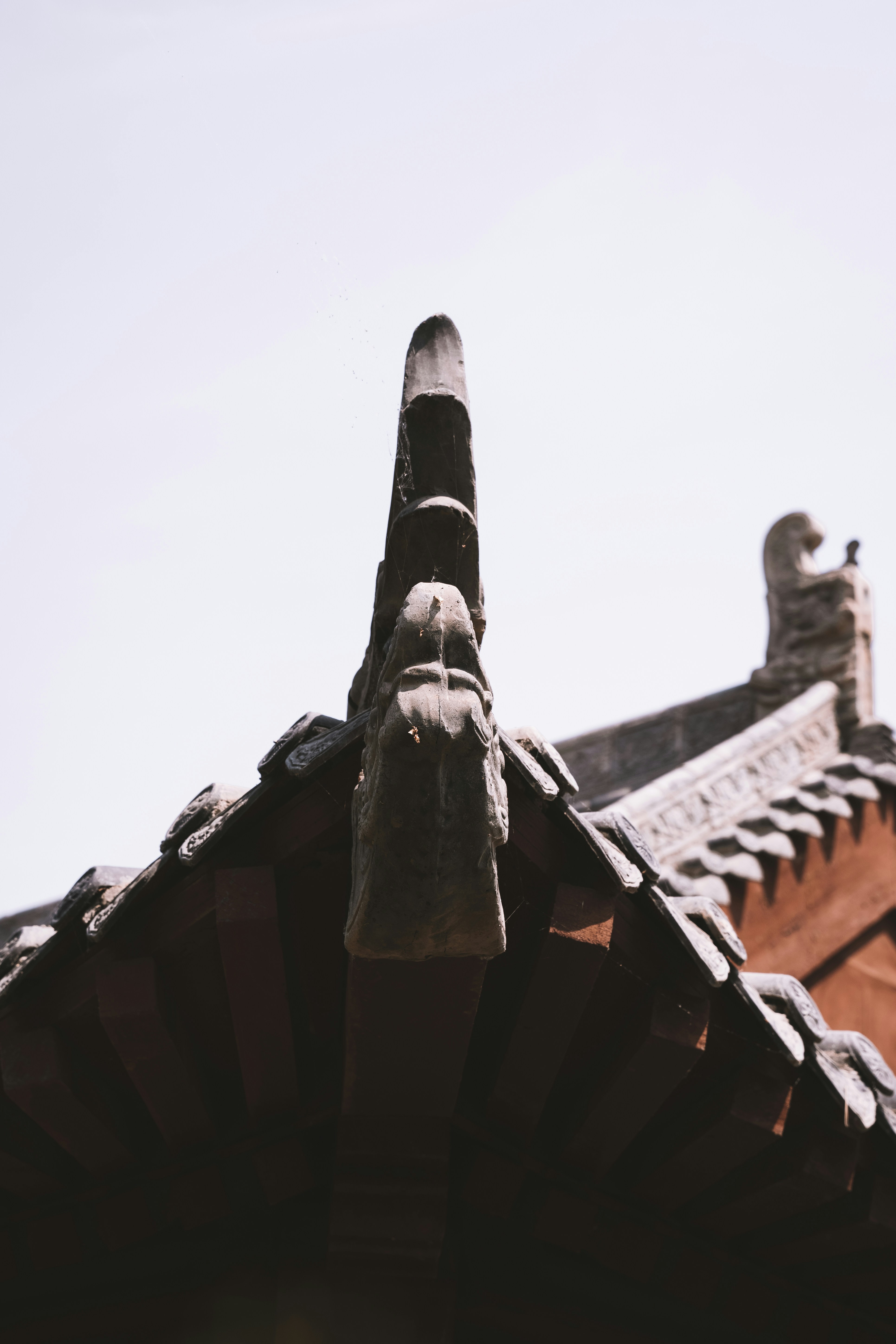 Dragon-Spine Finial on a Traditional Chinese Roof Eave