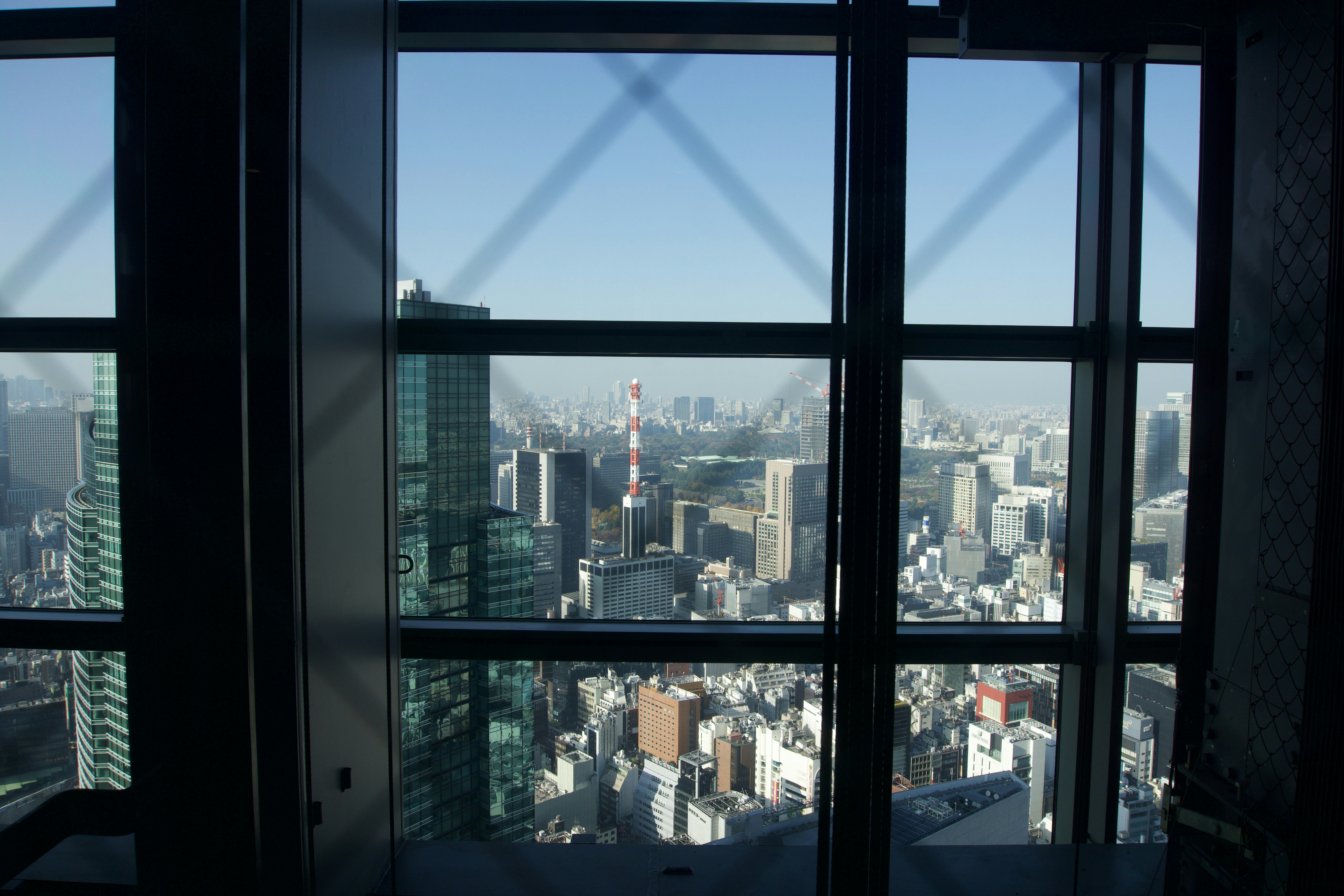 A view of a city through a window photo – Free City Image on Unsplash