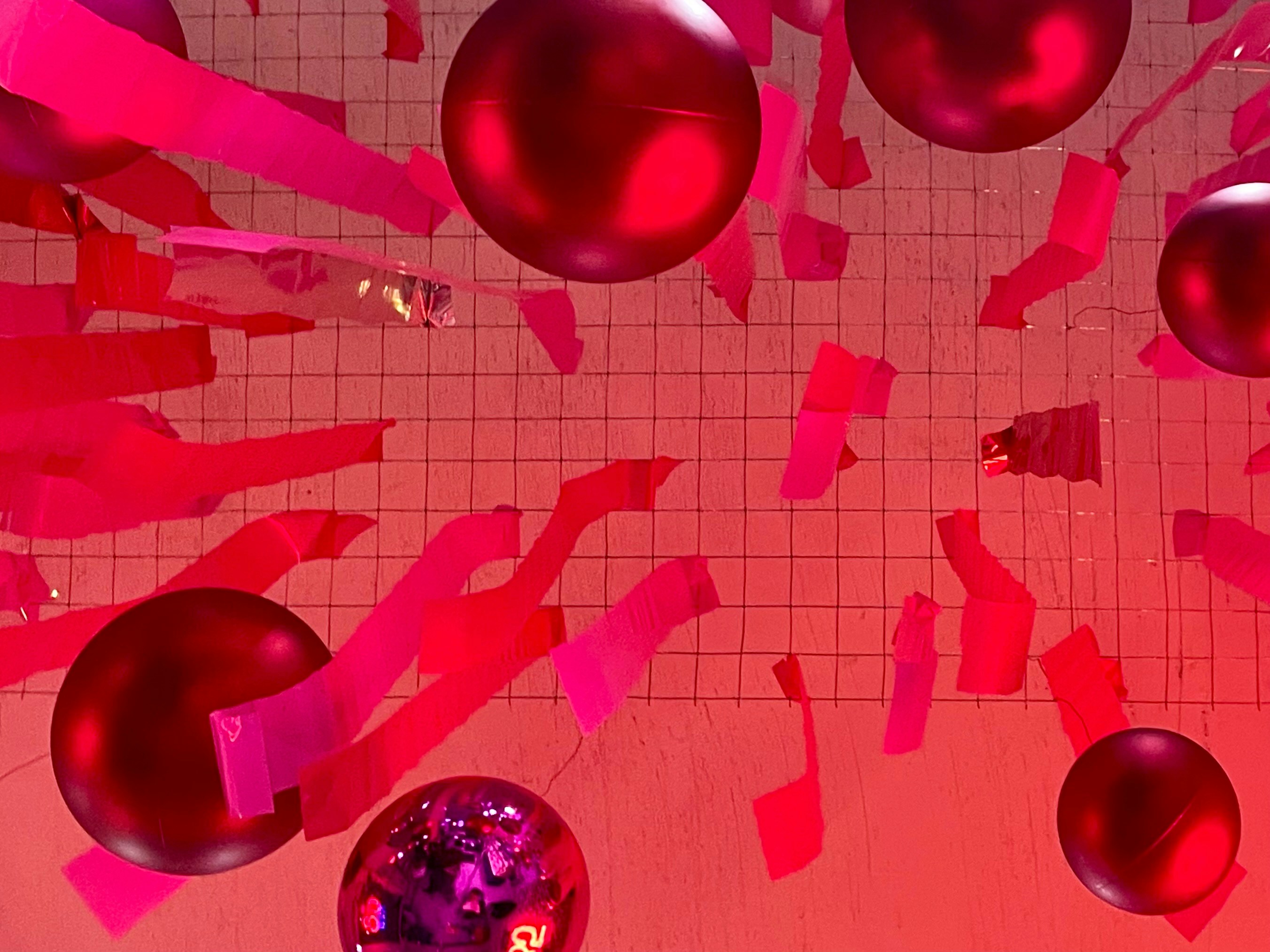 Red Confetti Collision: Shards and Spheres in a Festive Burst
