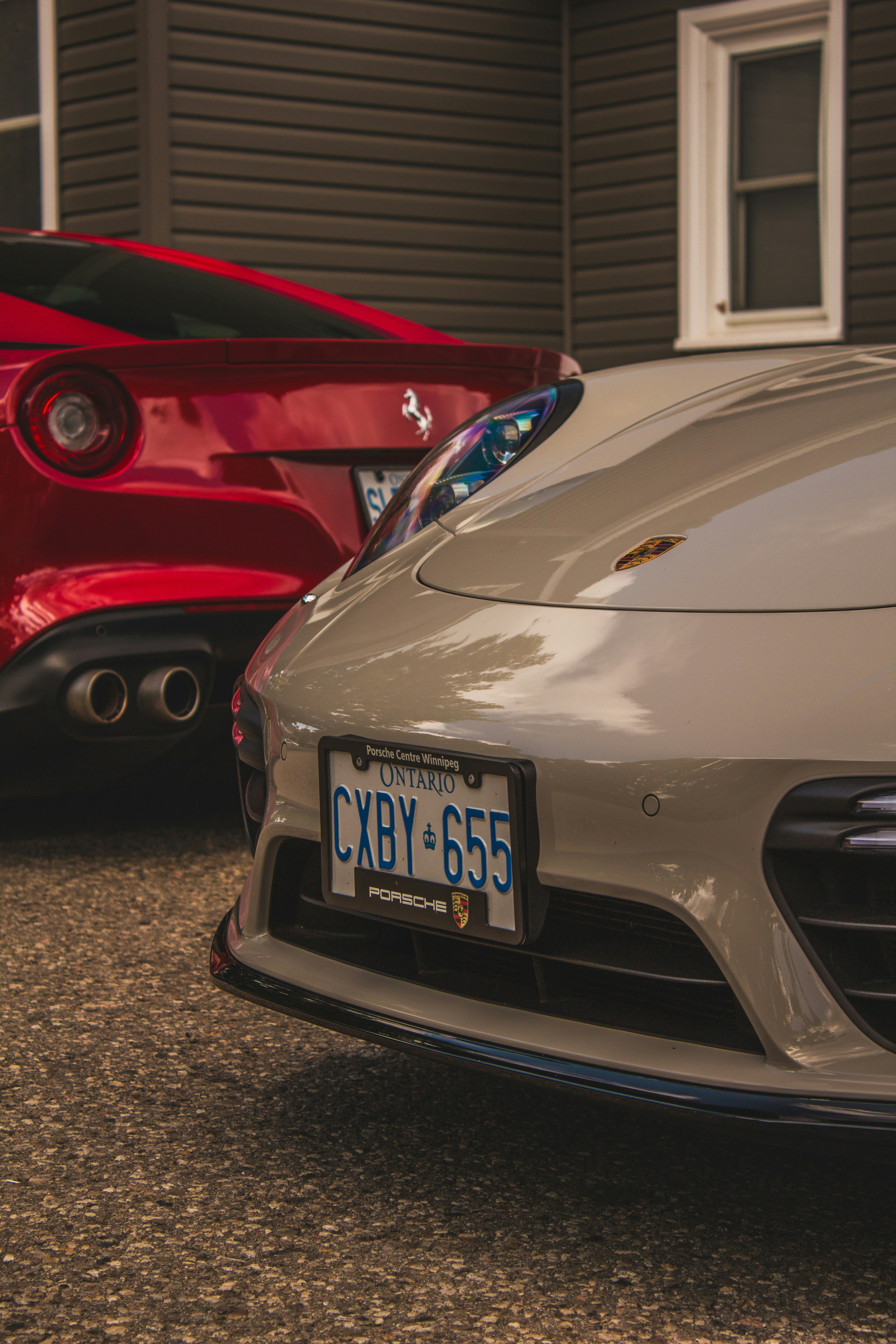Front Car Duo: The Silver Porsche Faces Off Against a Scarlet Tie