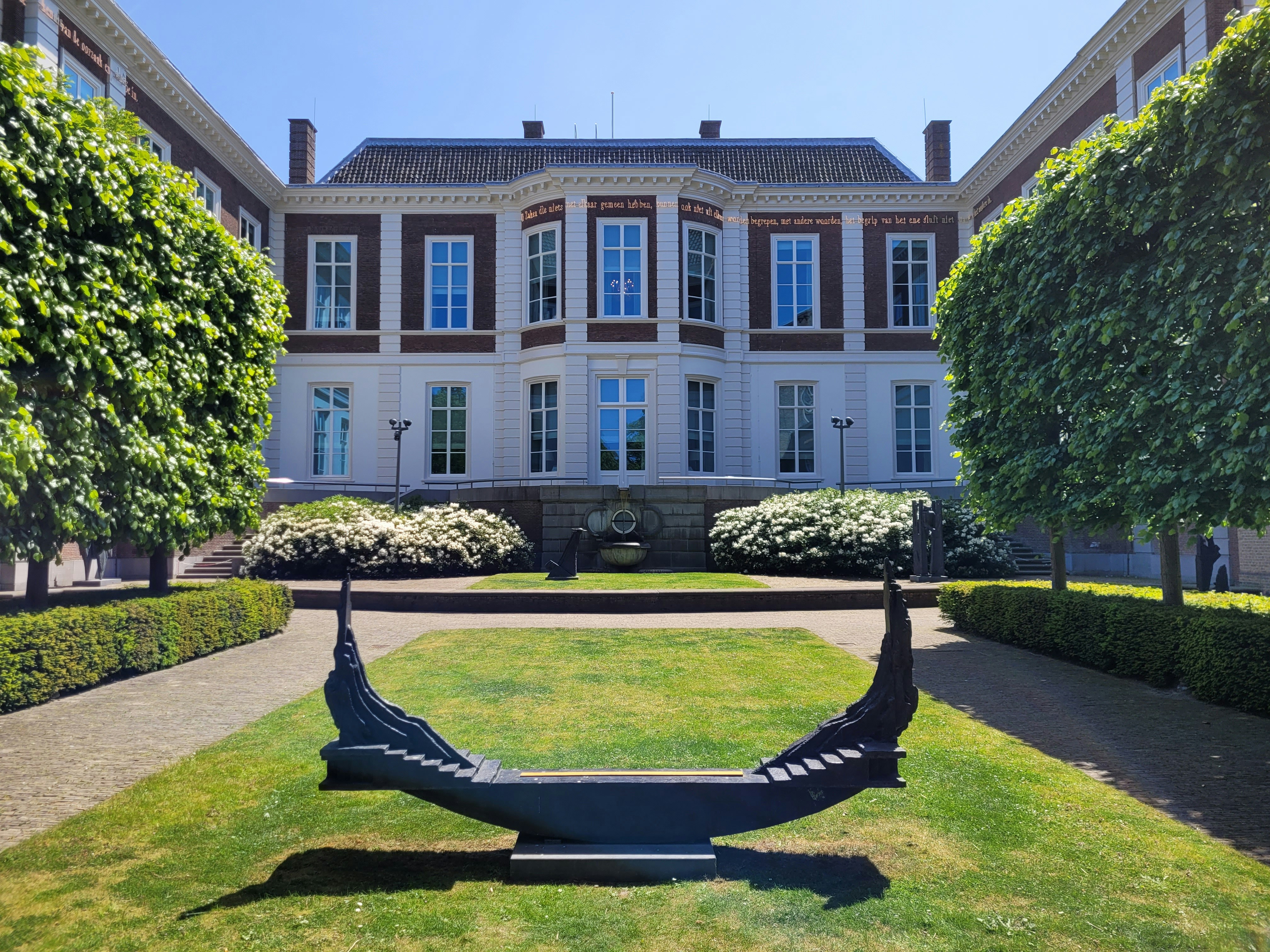 Symmetrical Courtyard Memorial with Central Art Nouveau Bench