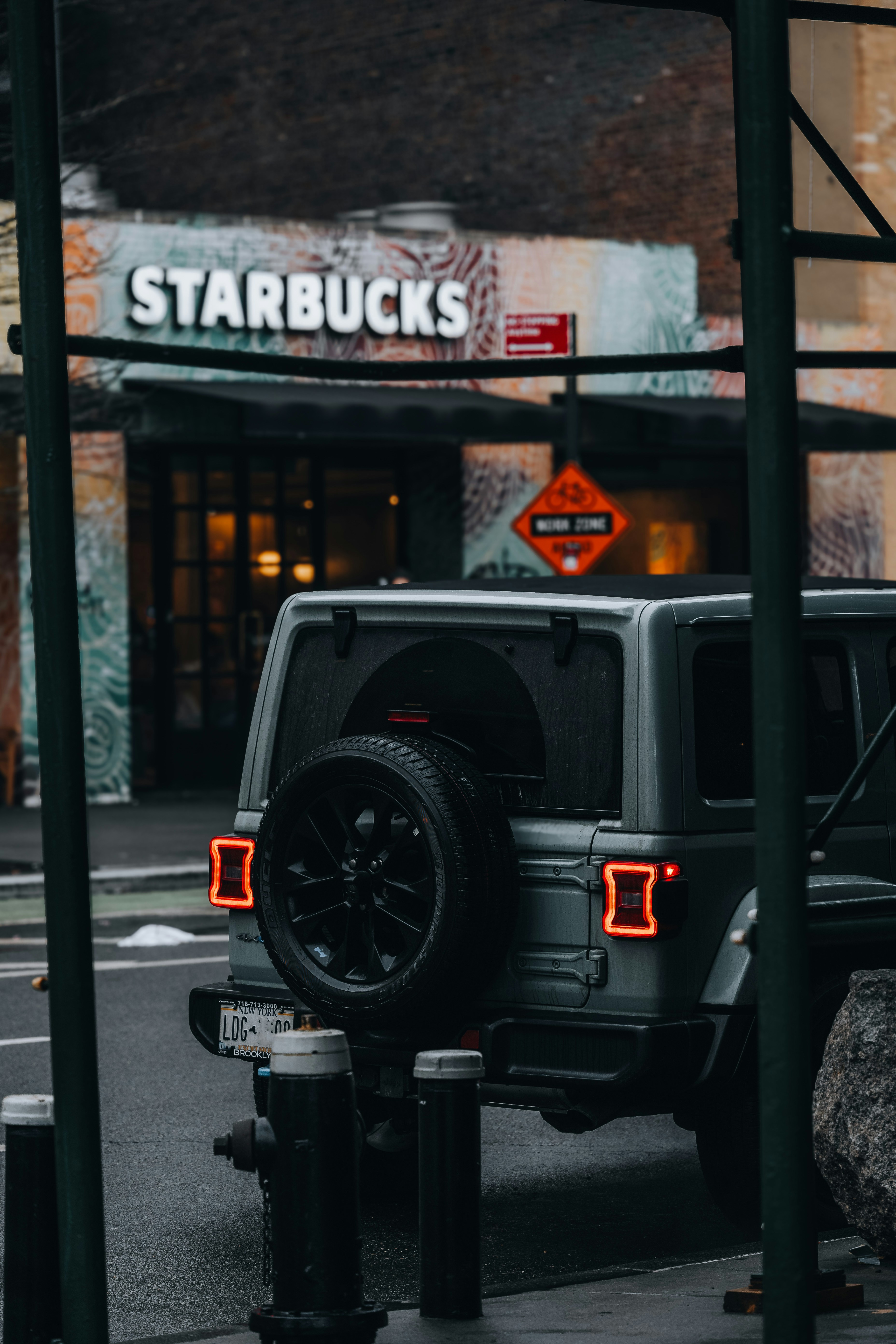 Spare Tire Portrait: Jeep Wrangler Framed by Starbucks Glow